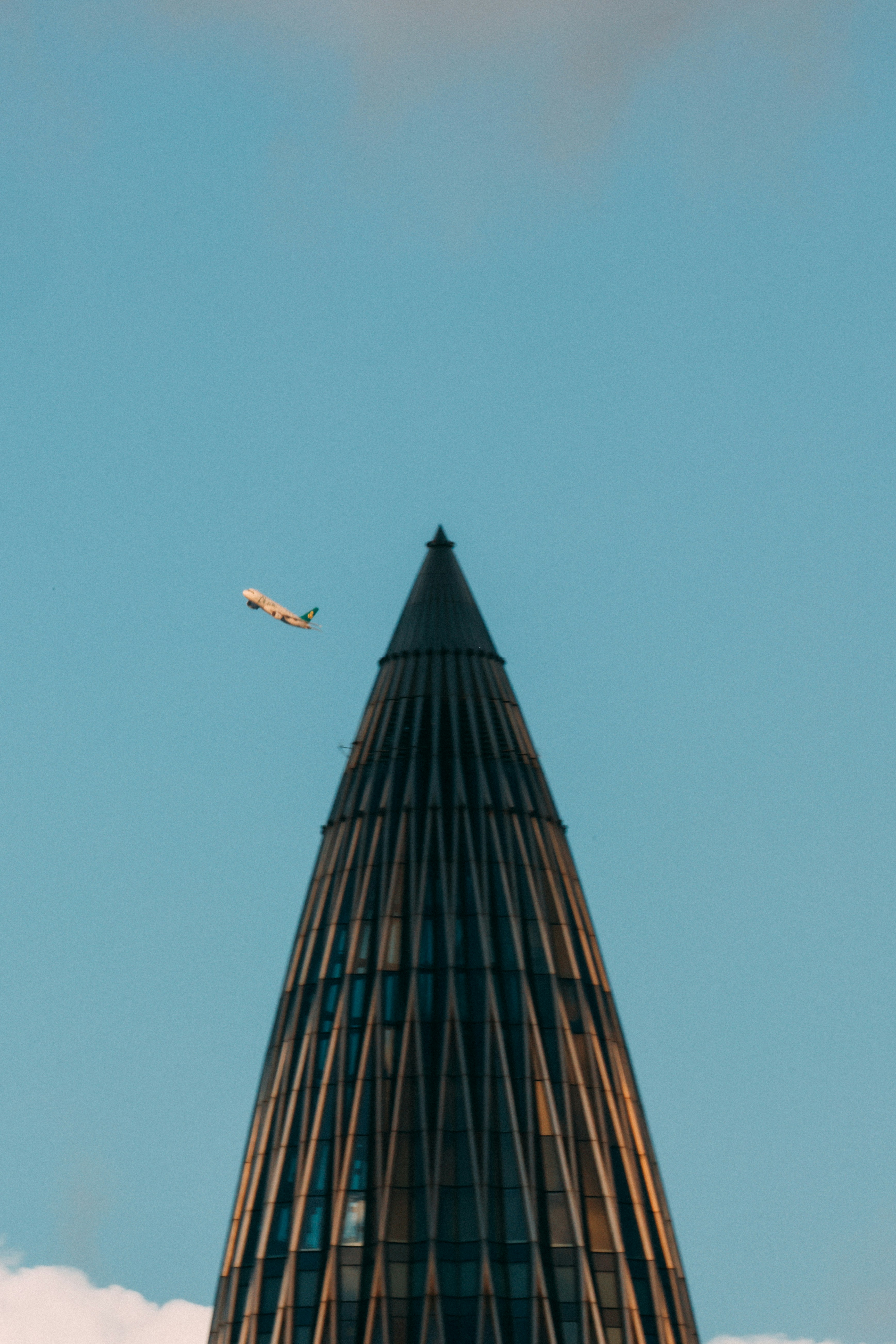 Aerial Ascent Above Architectural Pinnacle