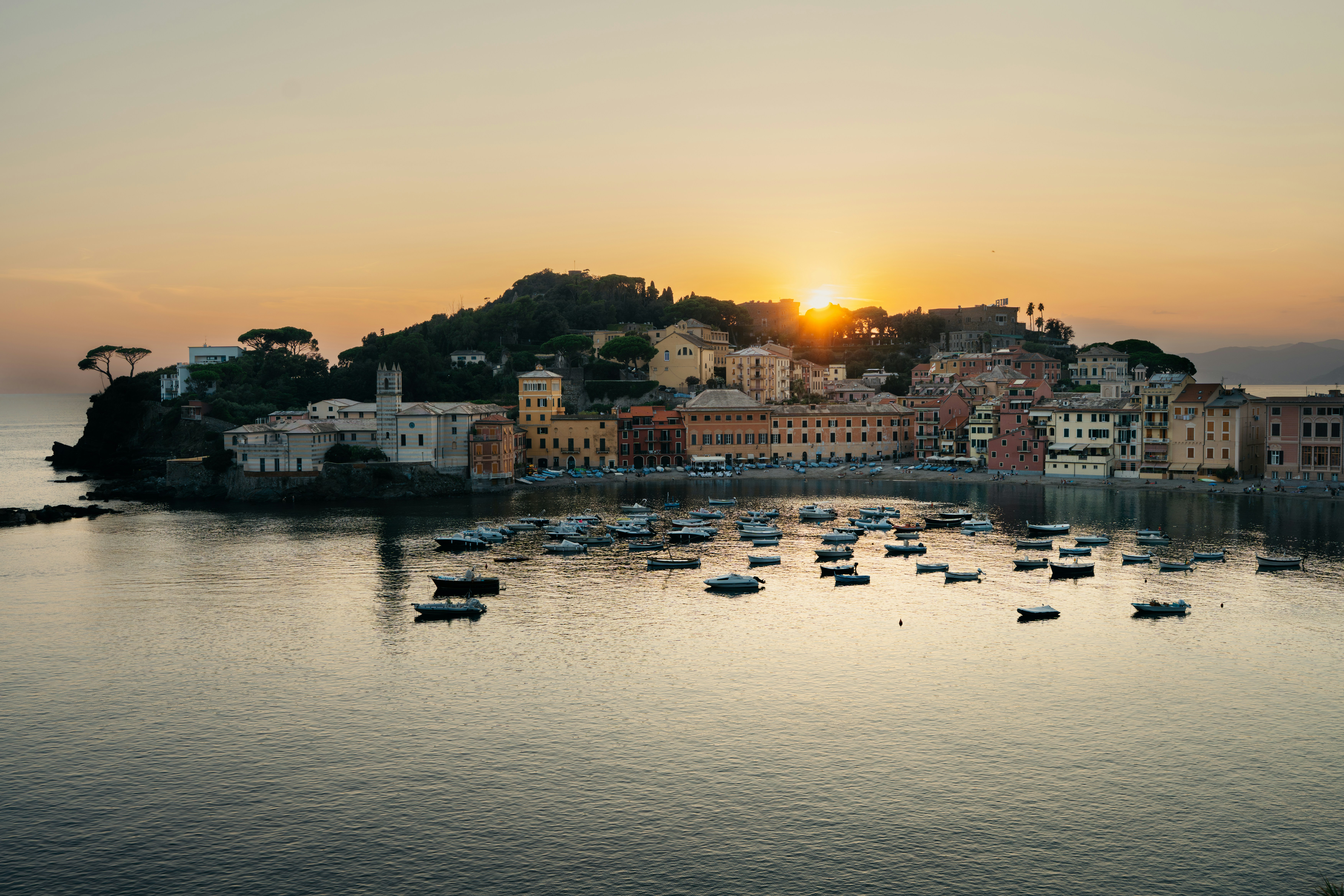 Coastal town with boats at sunrise