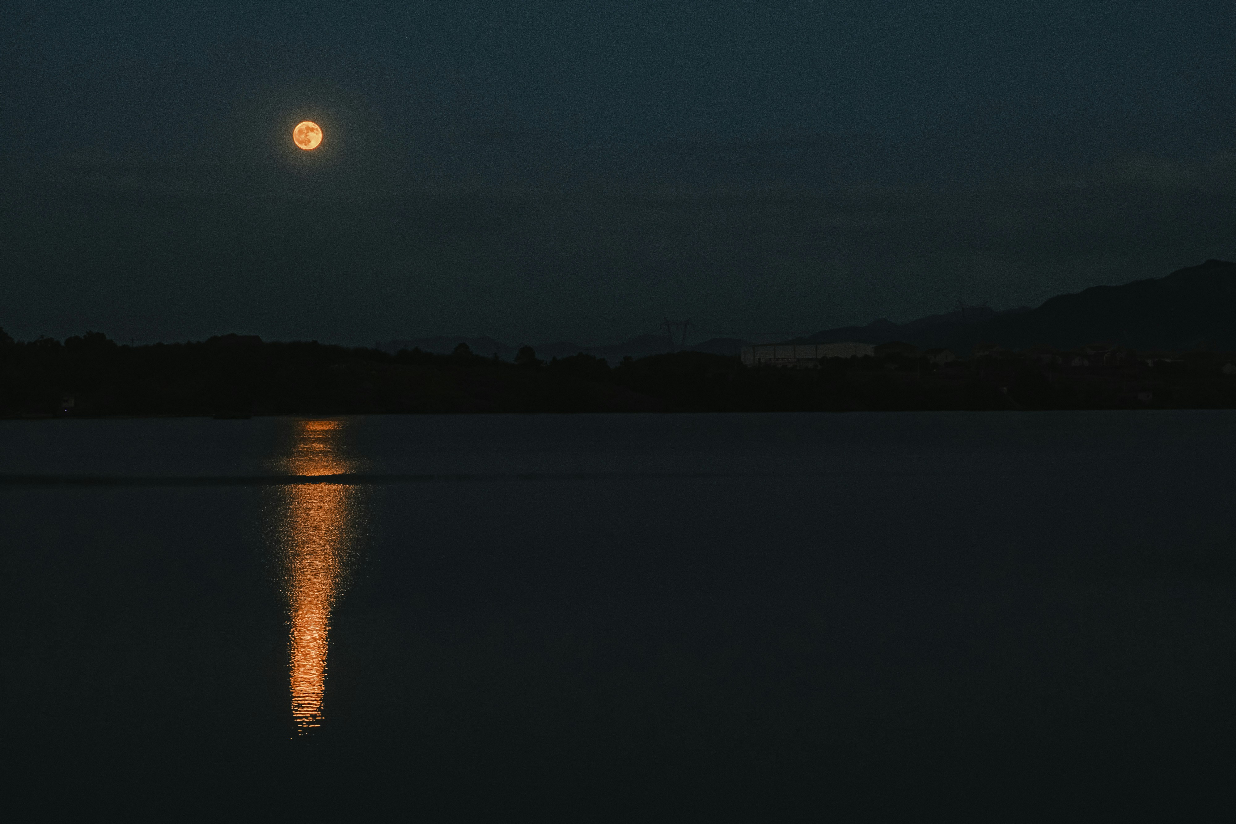 Lunar Reflections on Tranquil Waters