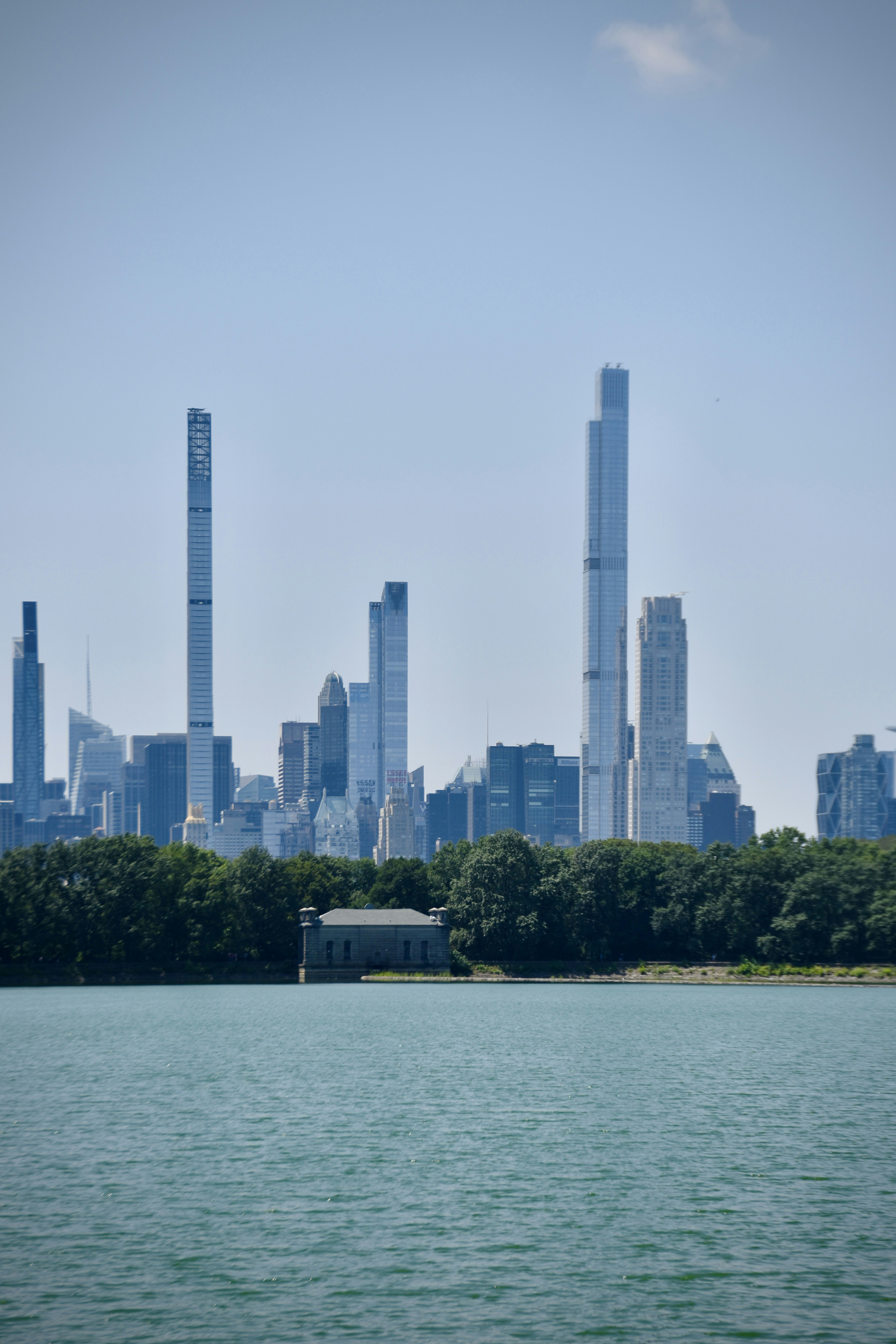 Blue Giants Over the Lake: A Modern Skyline Framed by Trees
