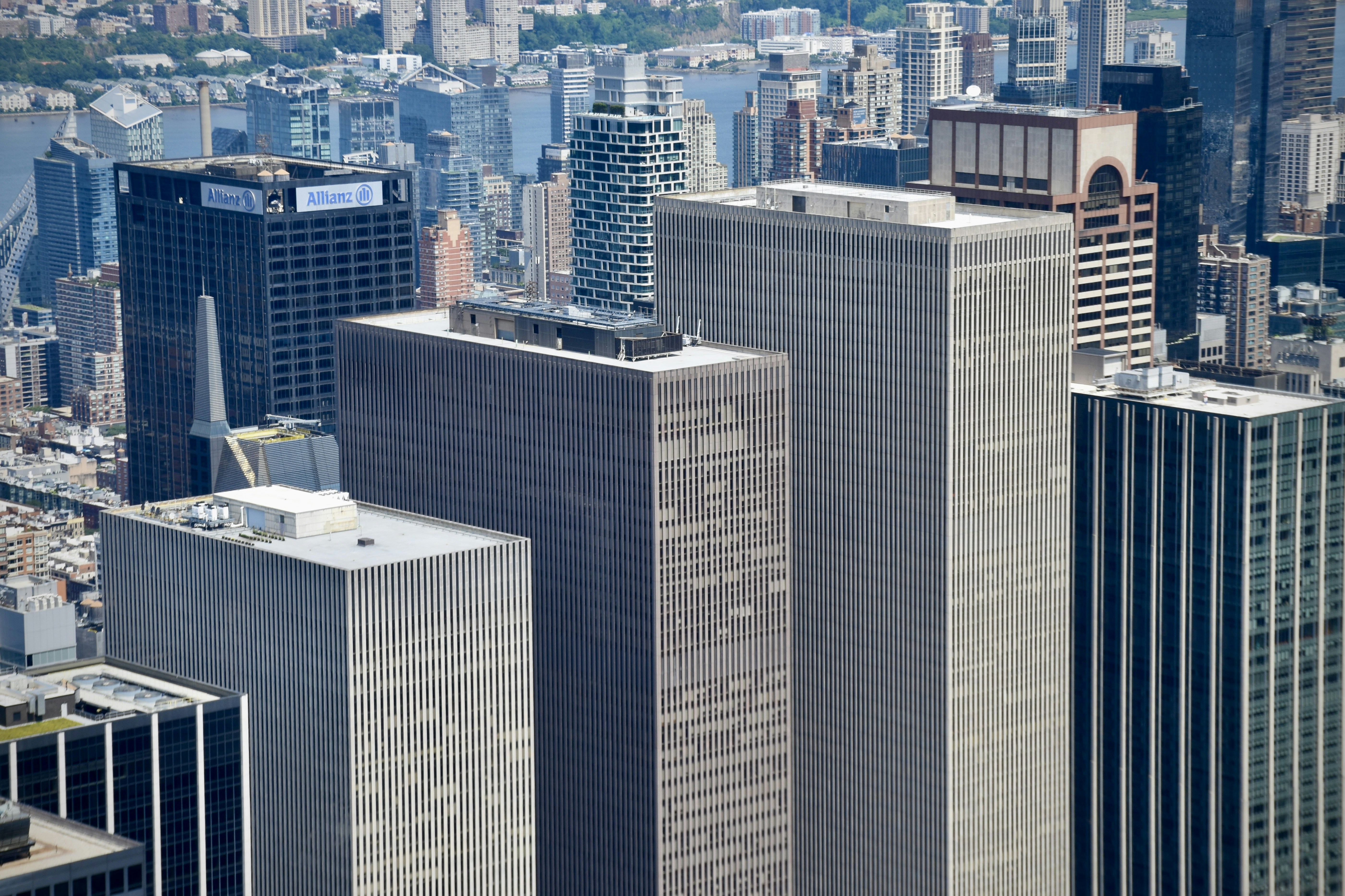 Modern skyscrapers rise above a hazy cityscape