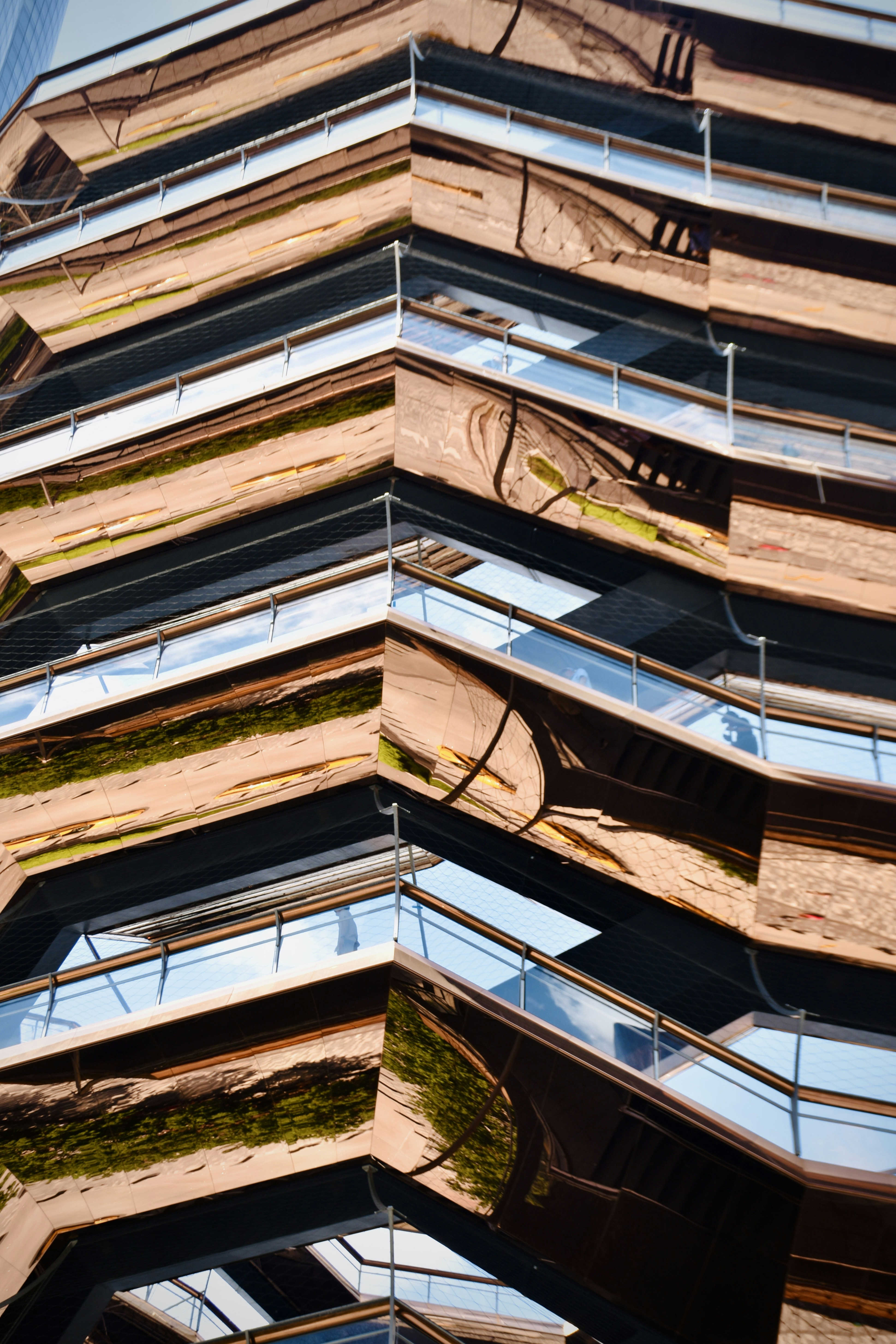 Reflective copper facade of modern architecture with balconies photo ...