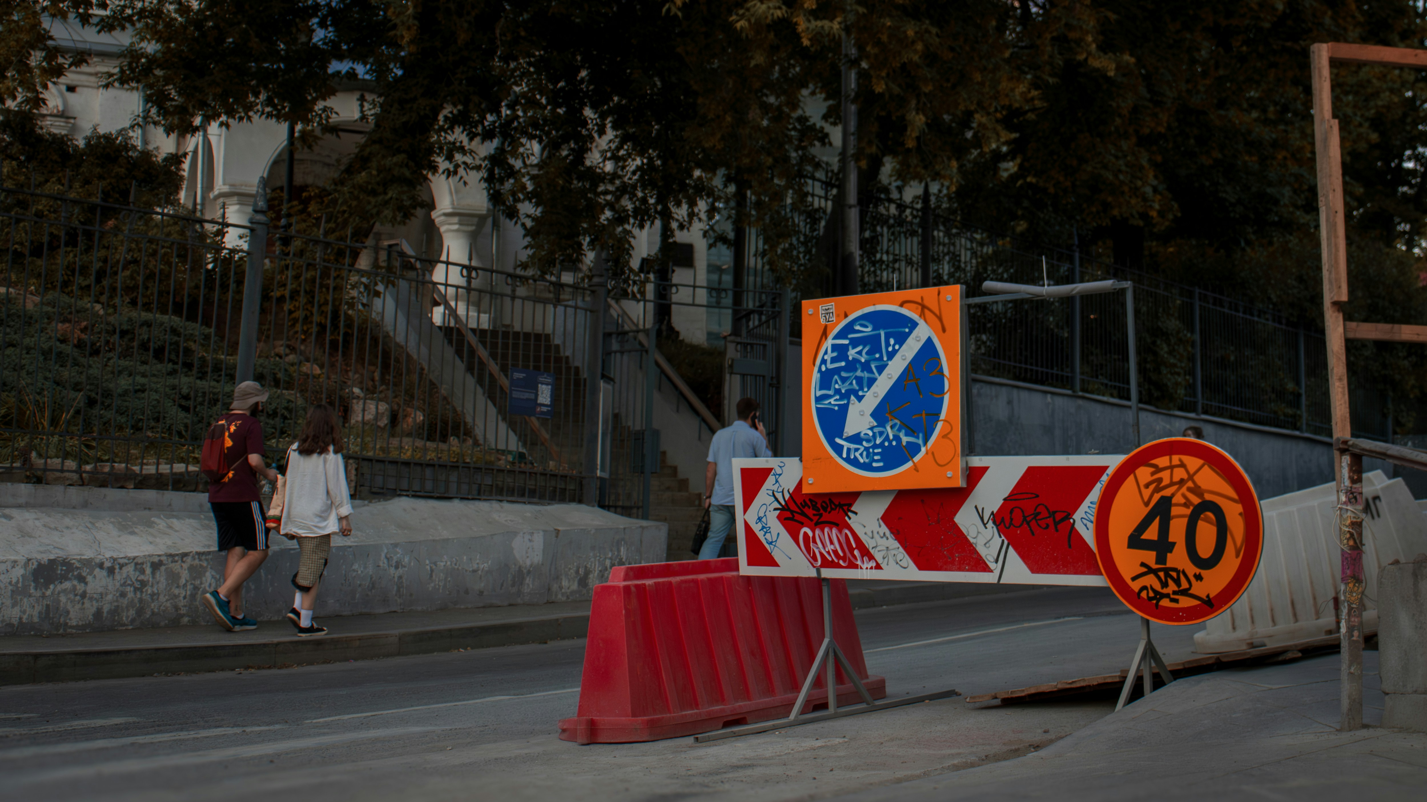 Road construction with traffic signs and barriers.