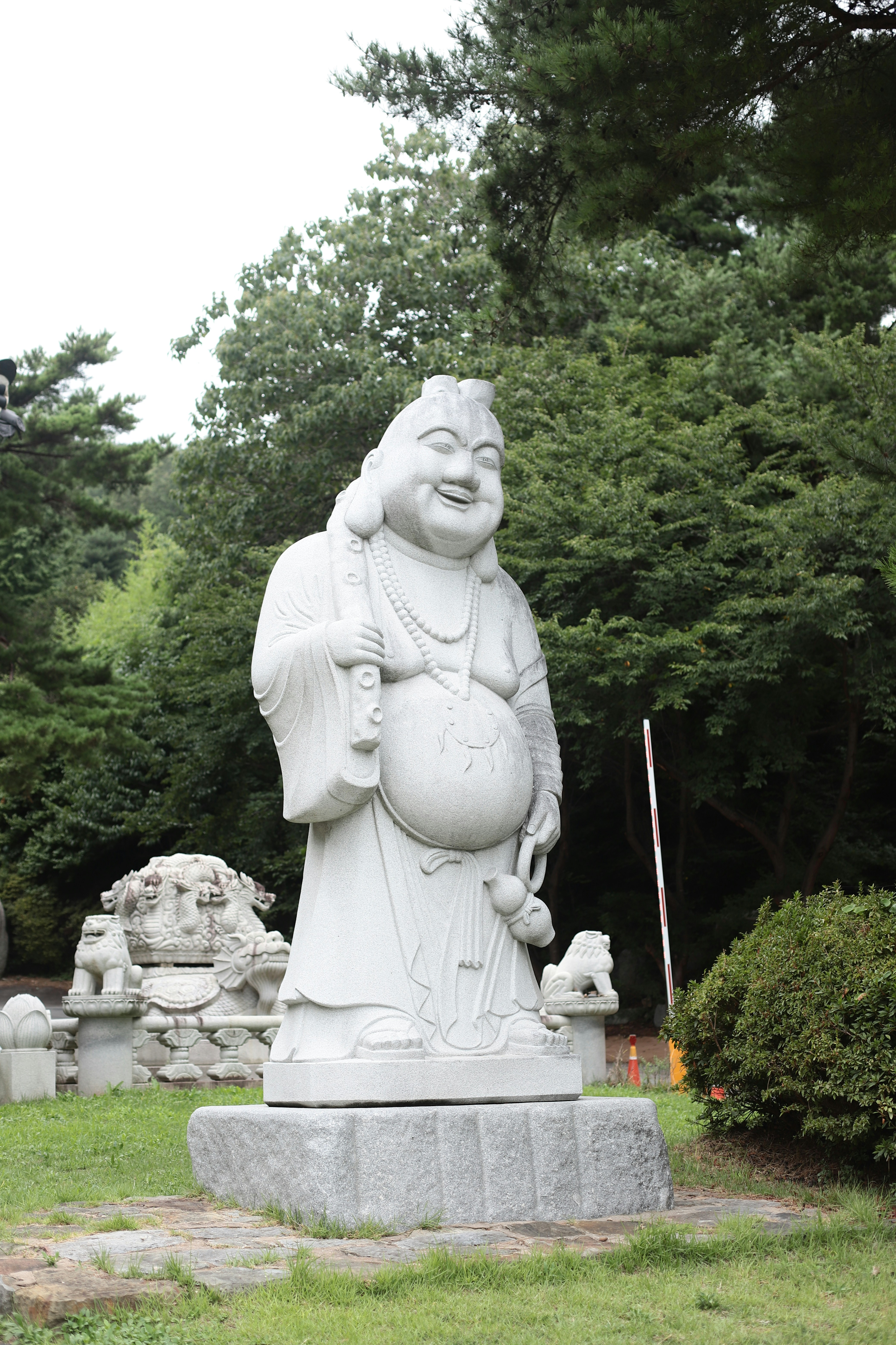 Guardian of Joy: The Serene Stone Figure