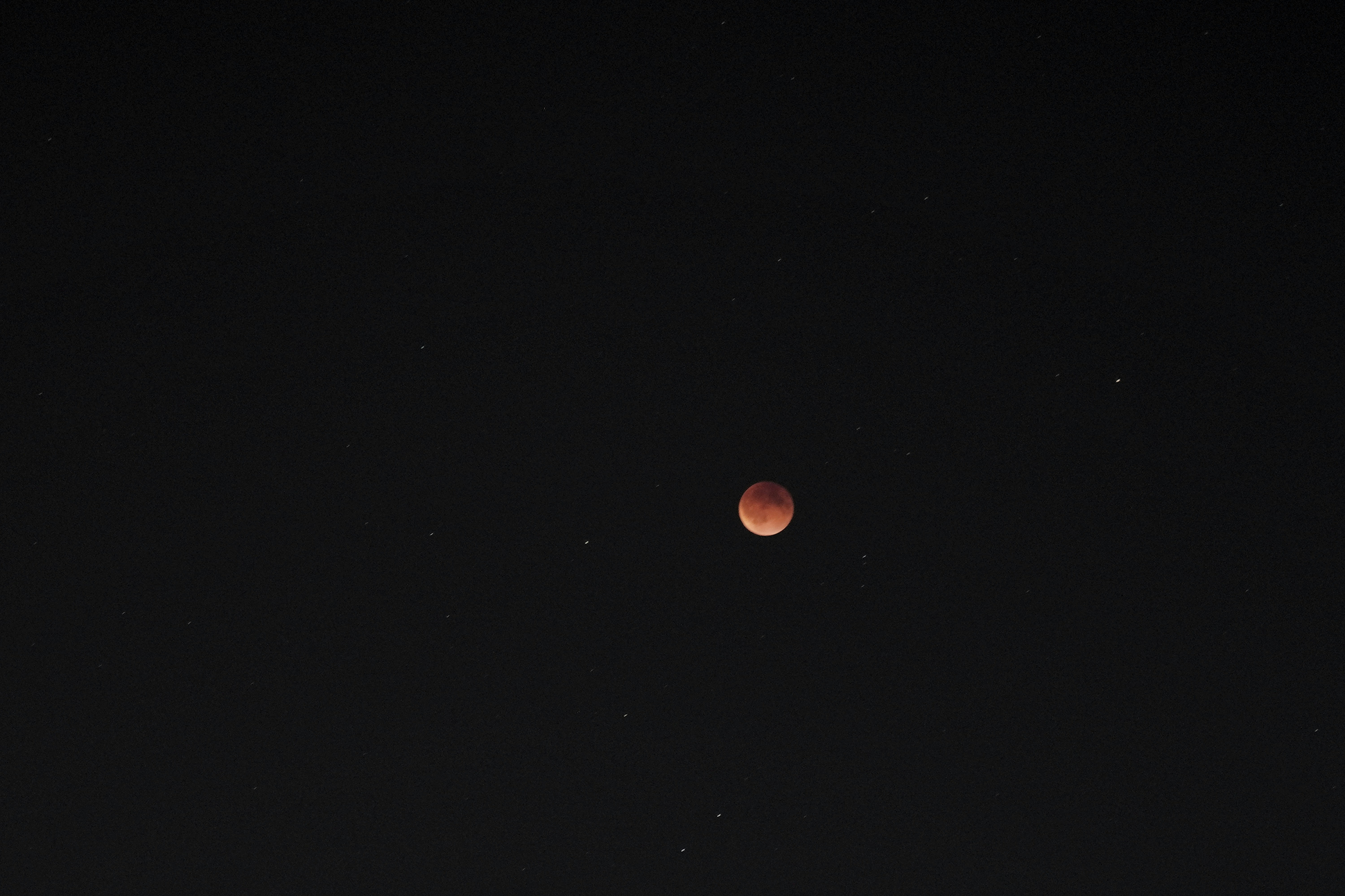 Celestial Ember: The Moon's Crimson Dance