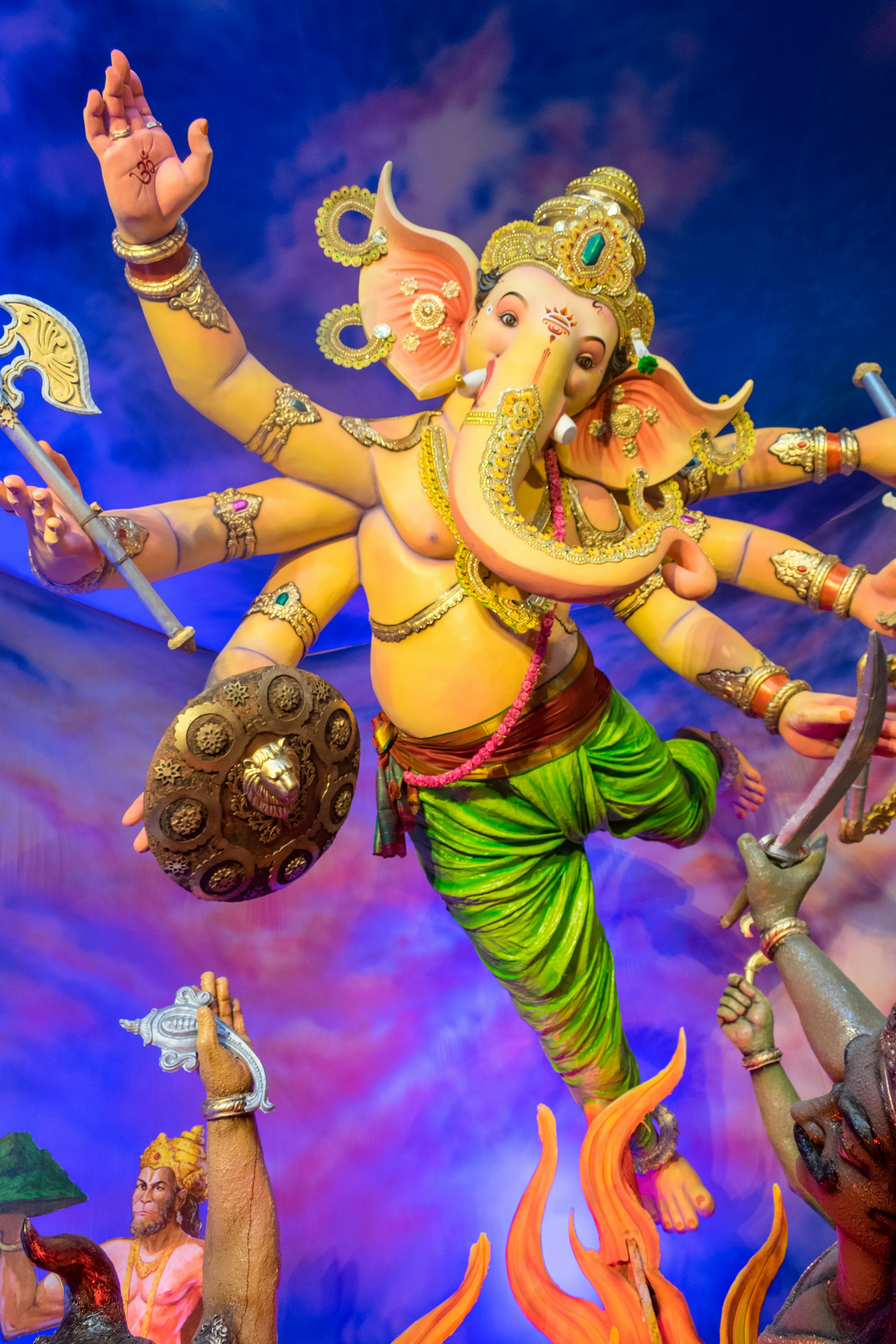 A colorful statue of lord ganesha with multiple arms photo – Free ...
