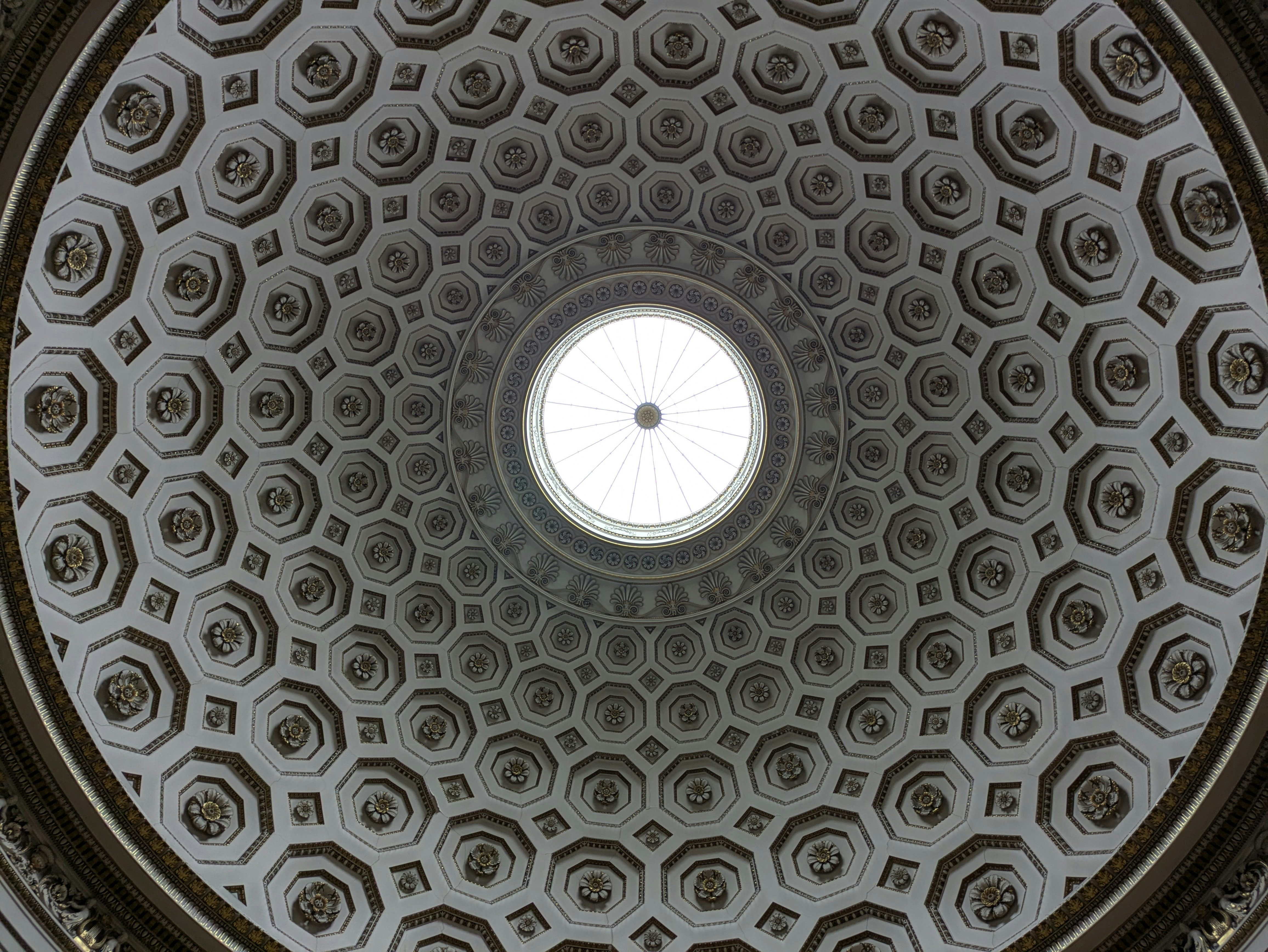 Intricate dome ceiling with a central skylight