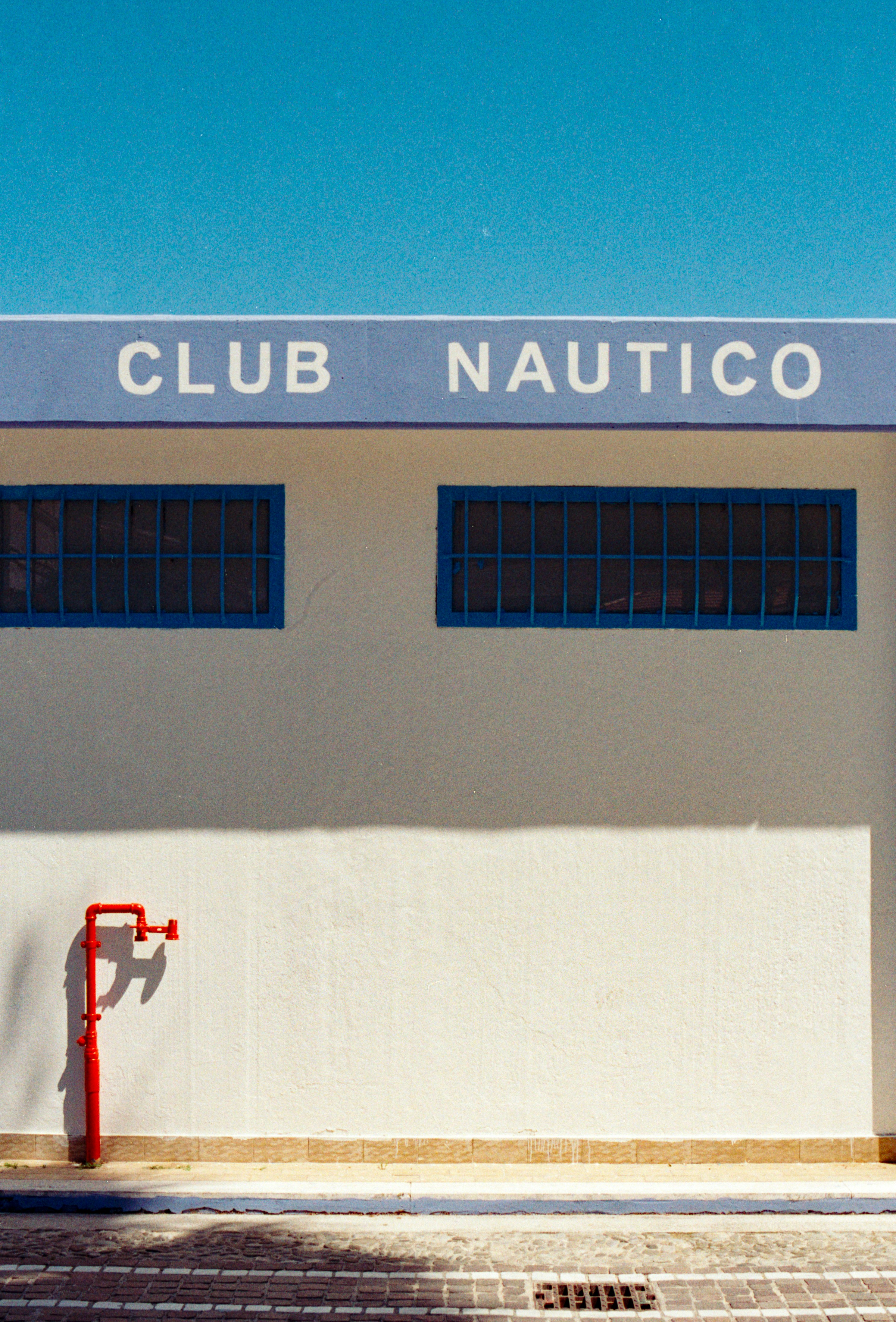 Club nautico building with red fire hydrant photo – Free Film ...