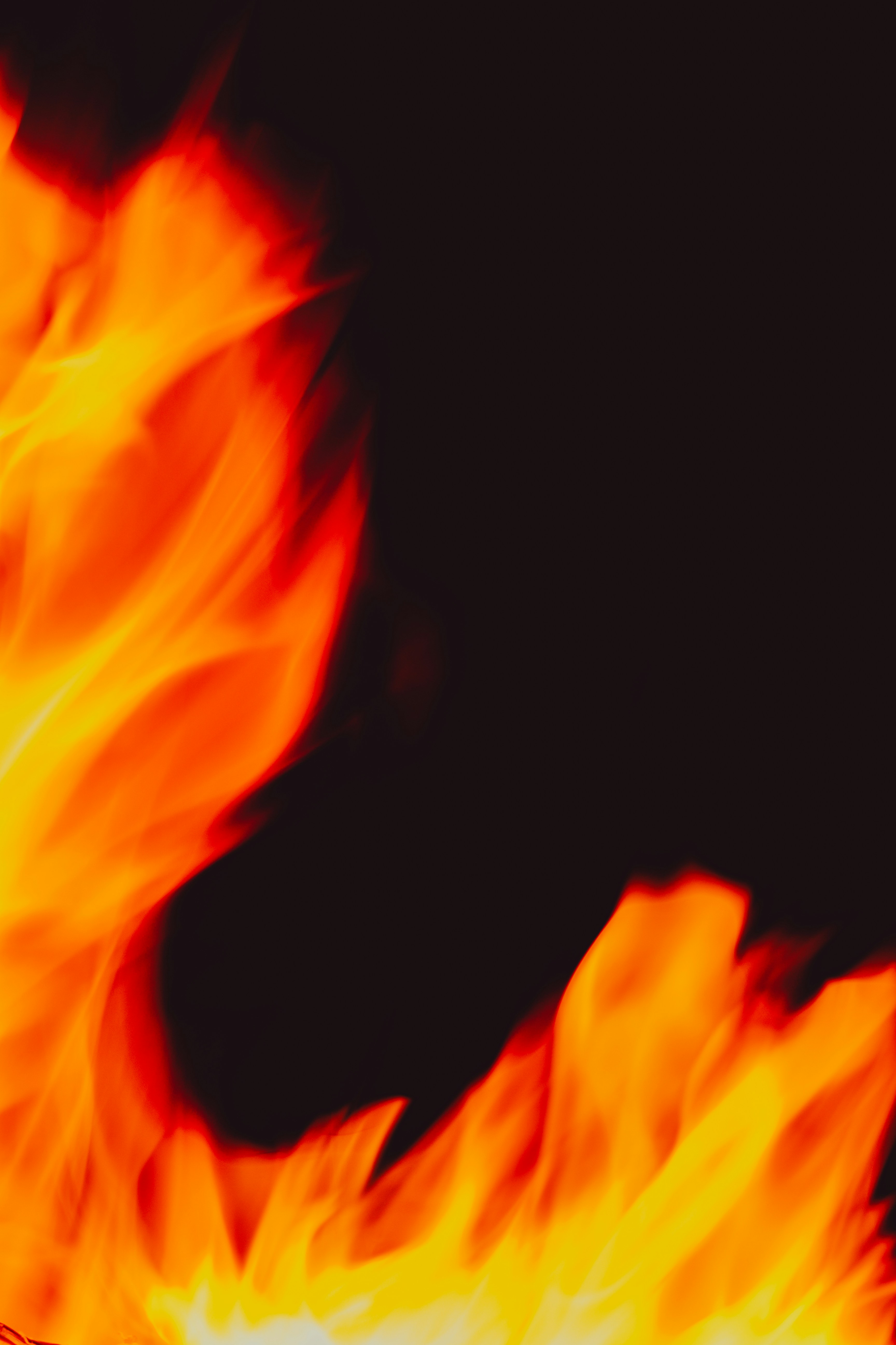 Vibrant orange flames against a dark background photo – Free Image on ...