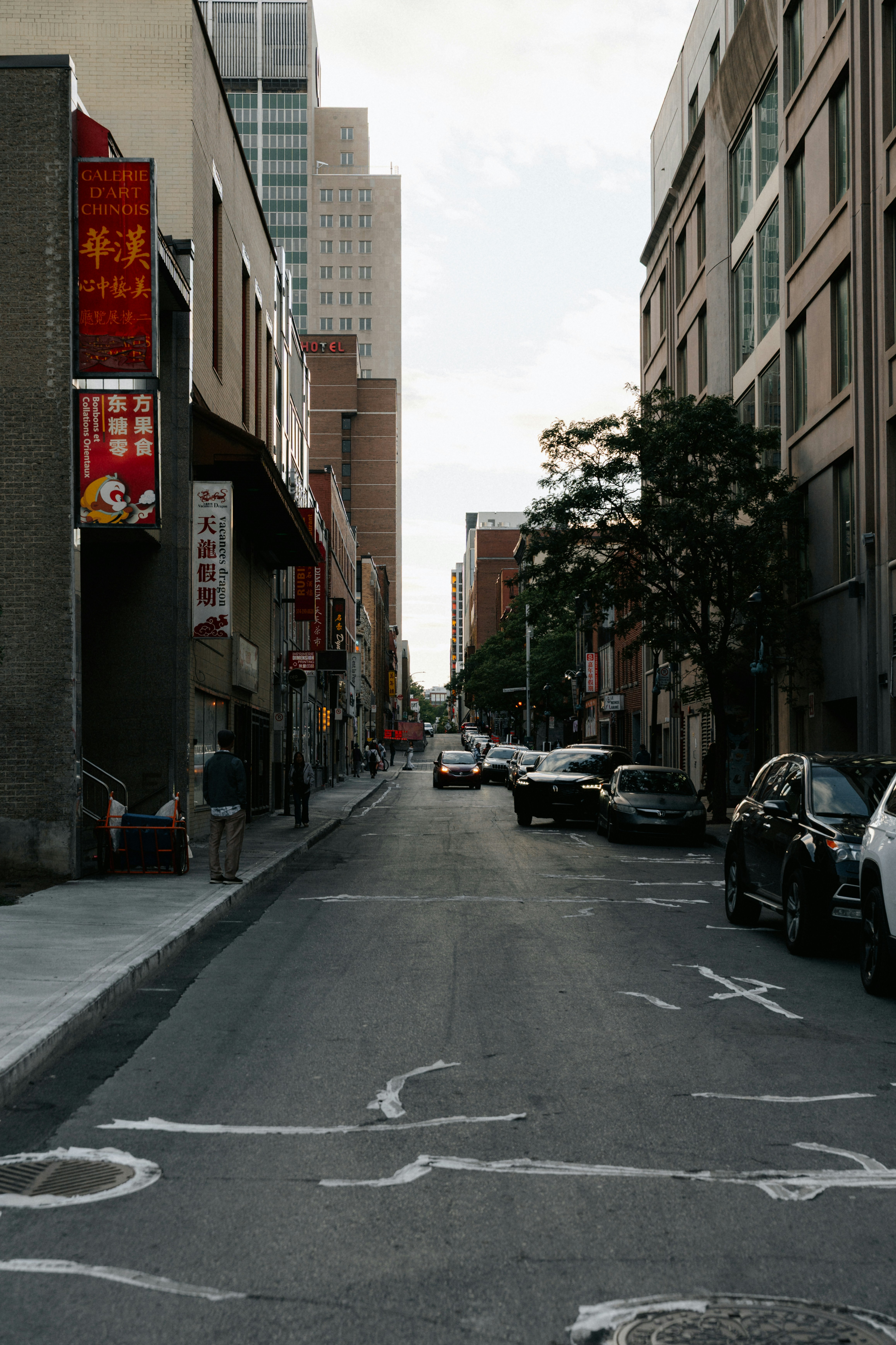 City street with cars parked and driving