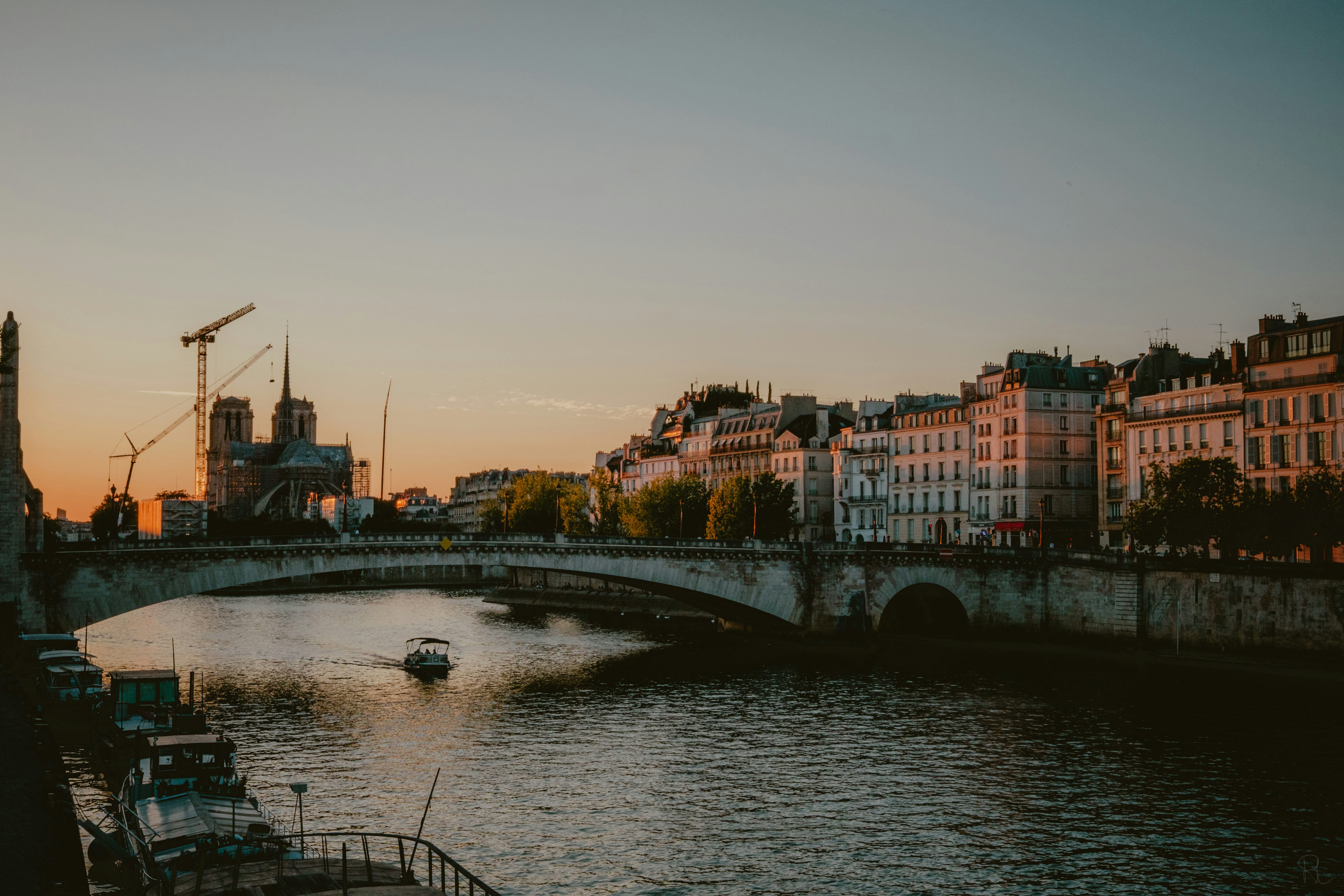Parisian cityscape with notre dame cathedral at sunset