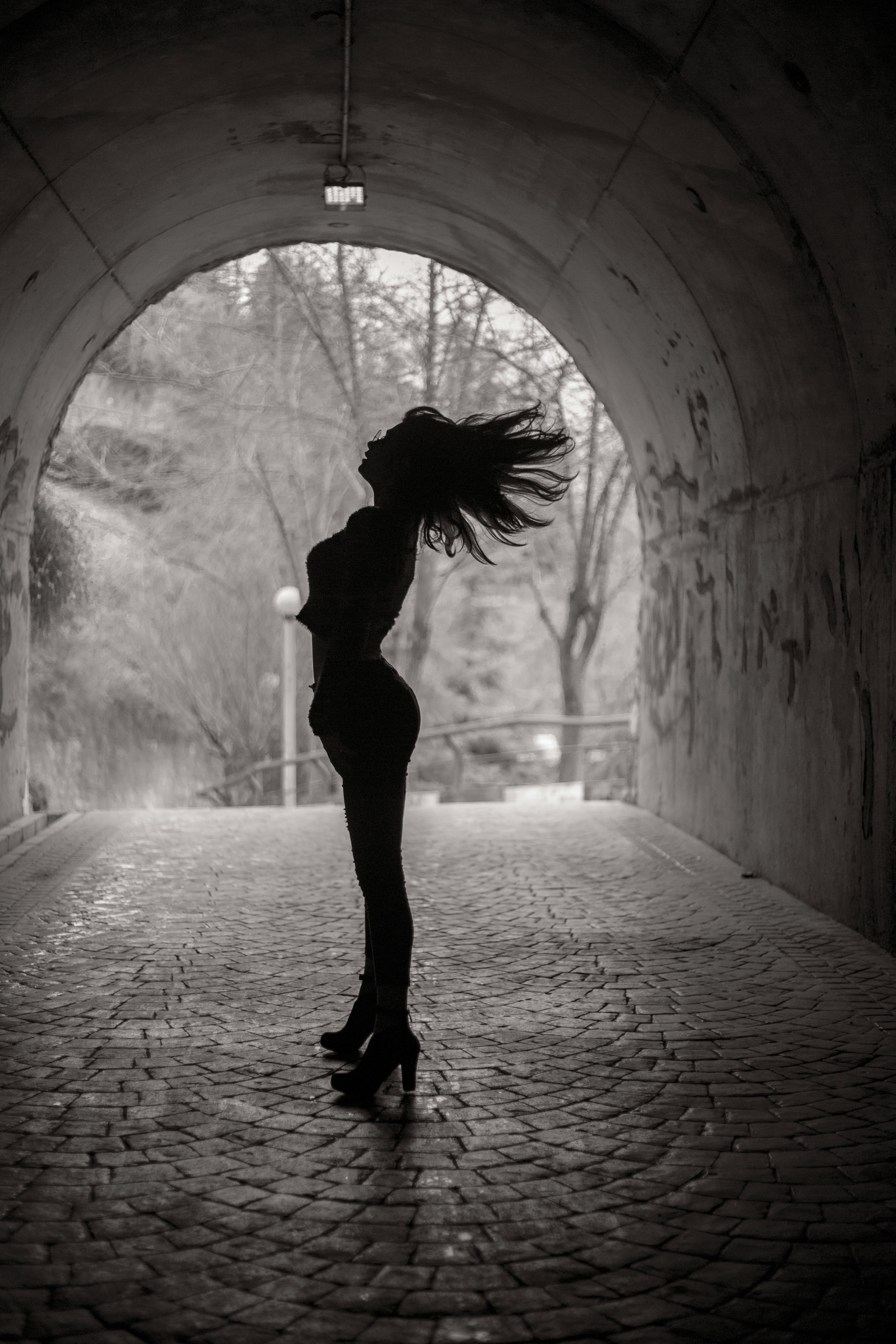 Embrace of Shadows: A Dance in the Tunnel
