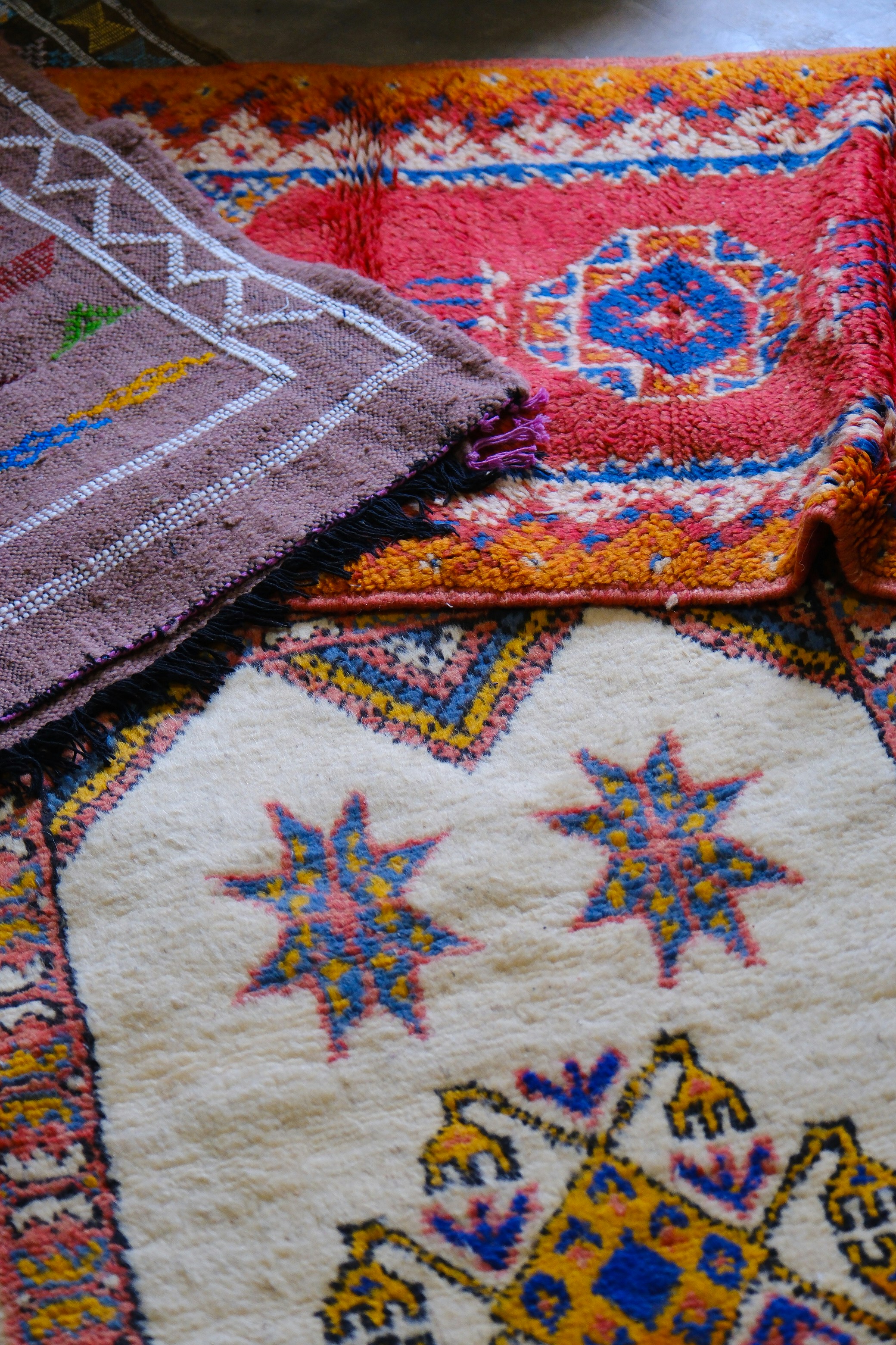 Colorful woven rugs with intricate geometric patterns