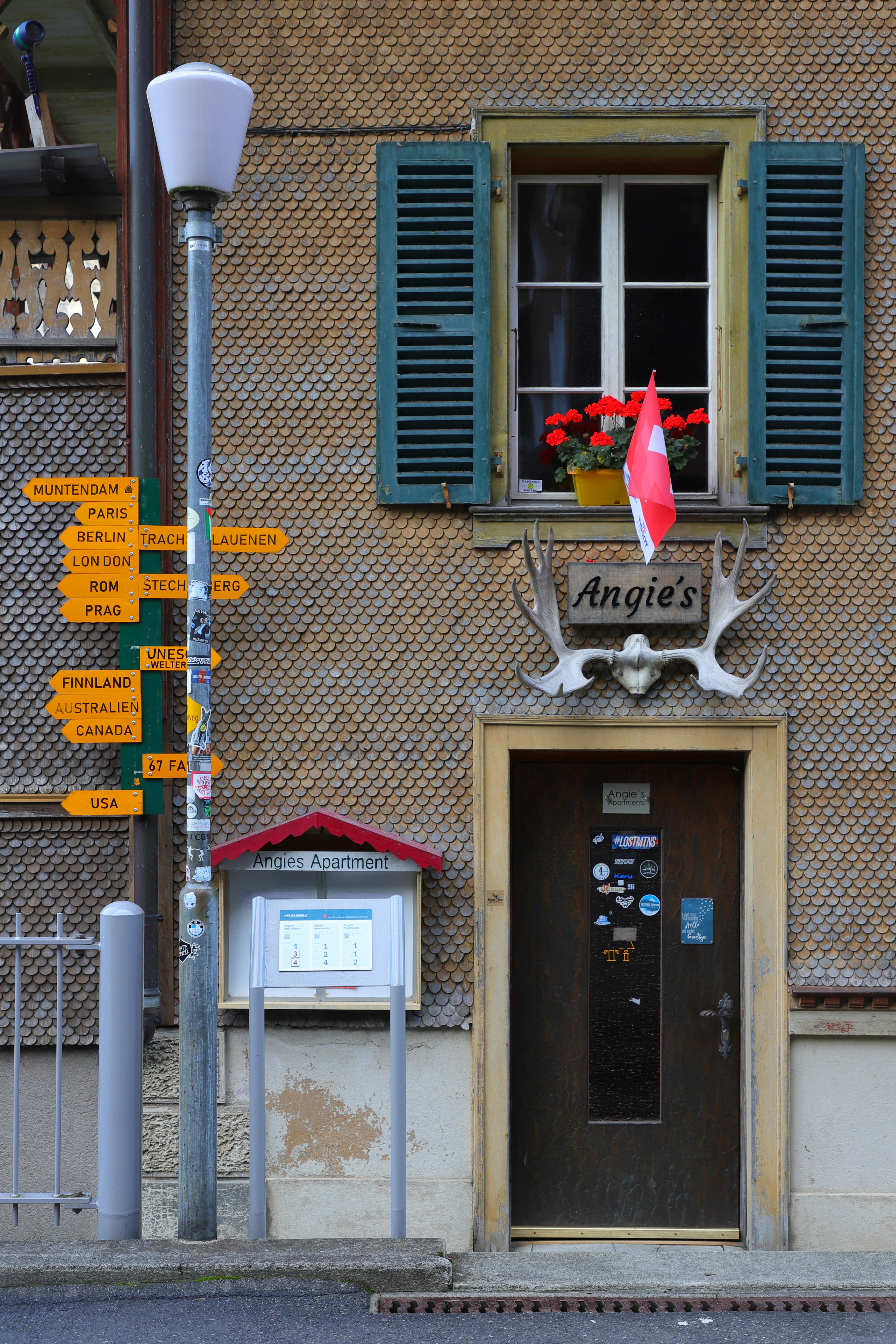 Doorway with "angie's" sign and antler decoration