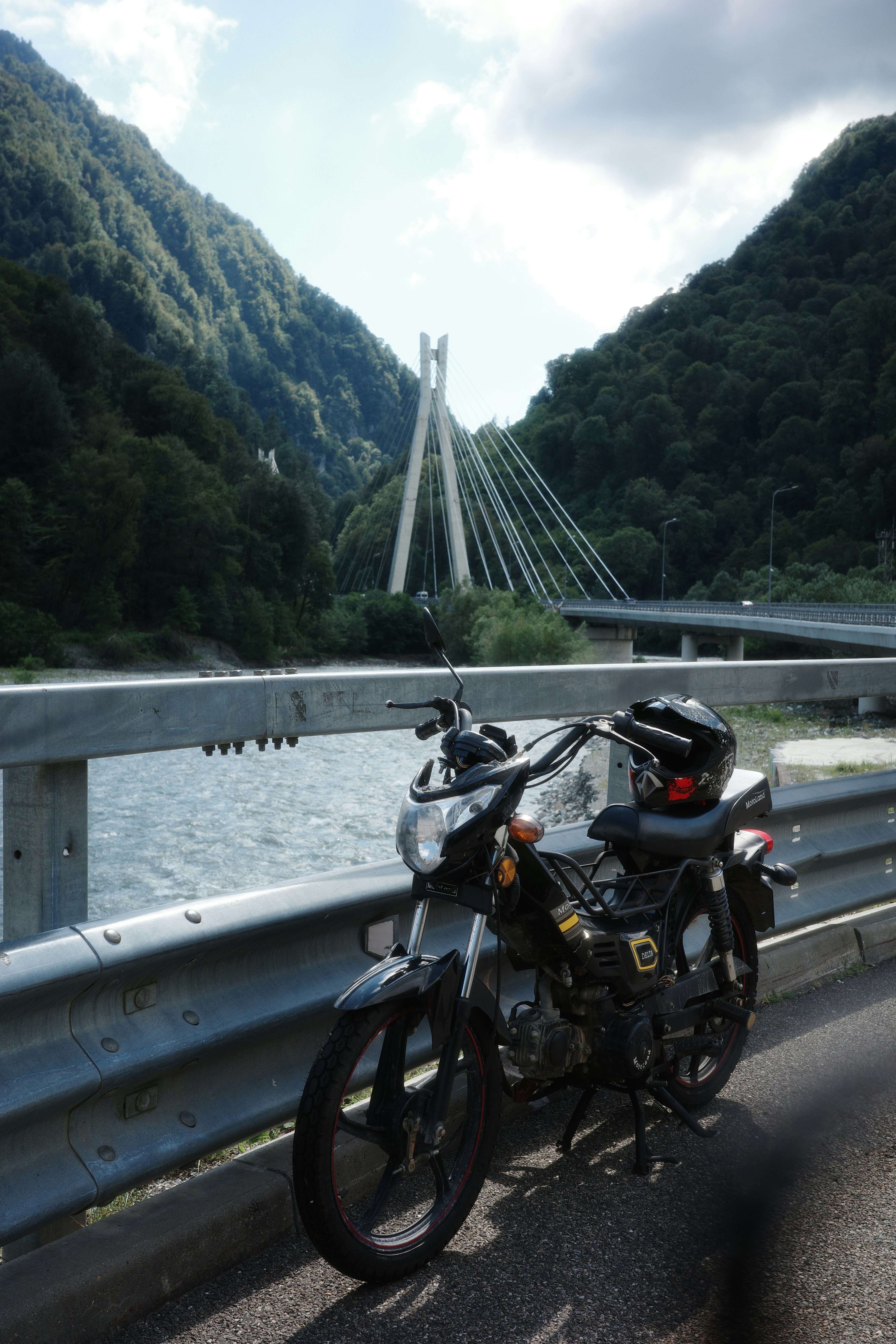 Journey's Pause: A Motorcycle's Rest by the River