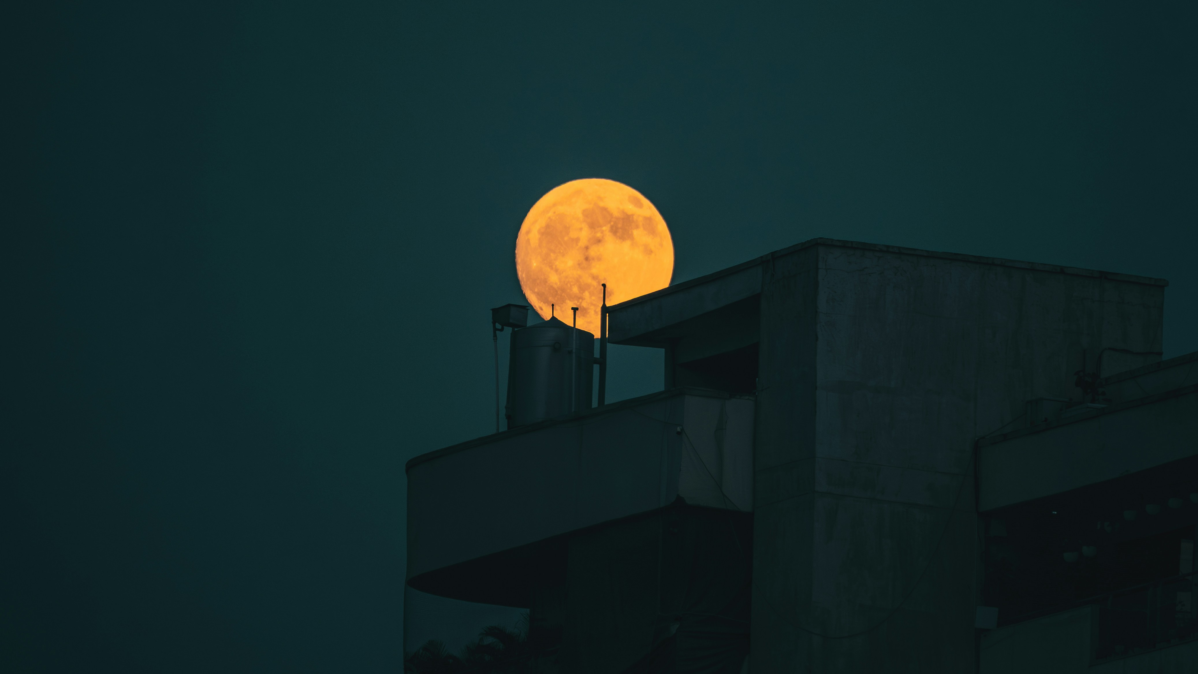 Lunar Glow Over Urban Silhouettes