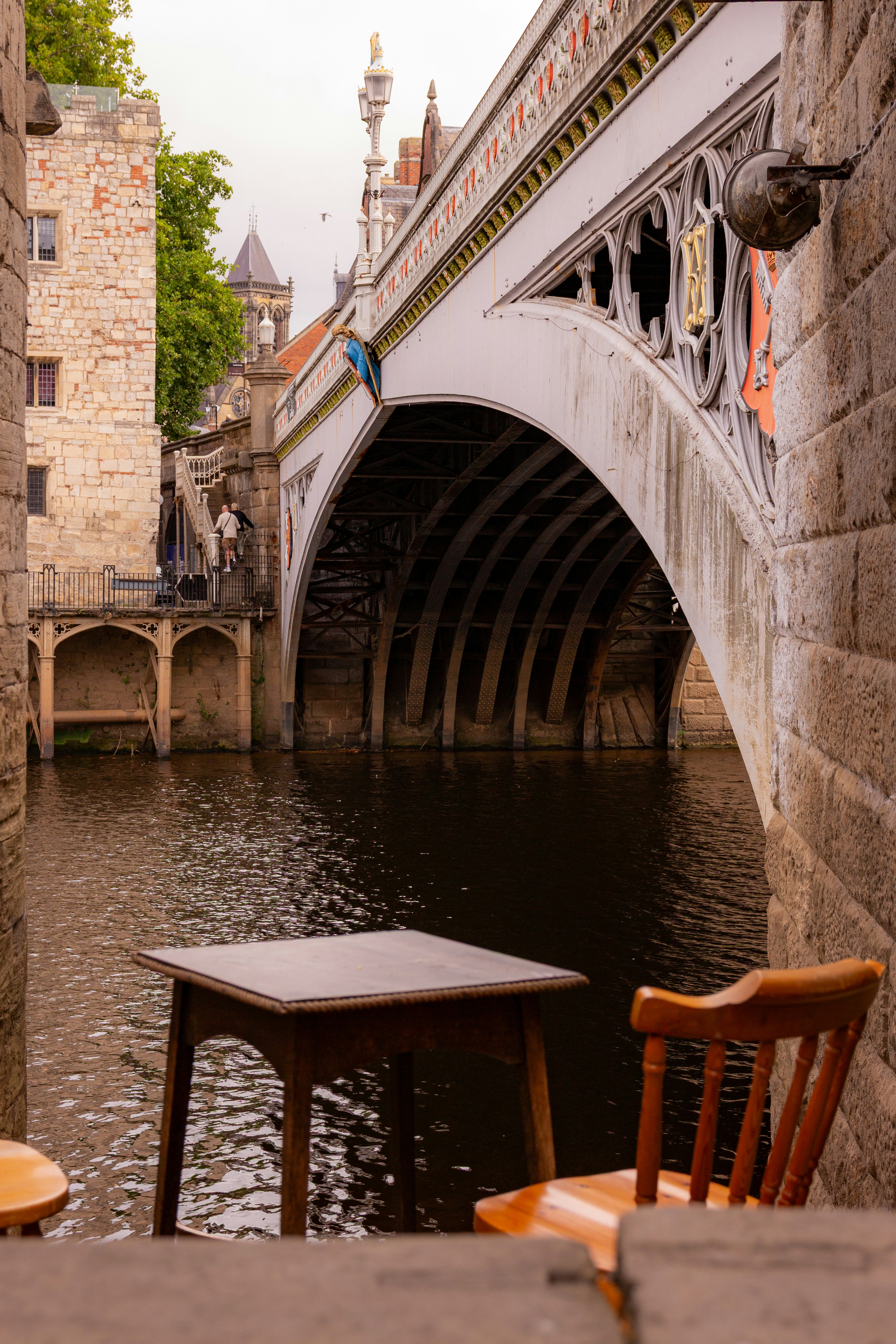 Arc of Quiet Light Over a Riverside Table