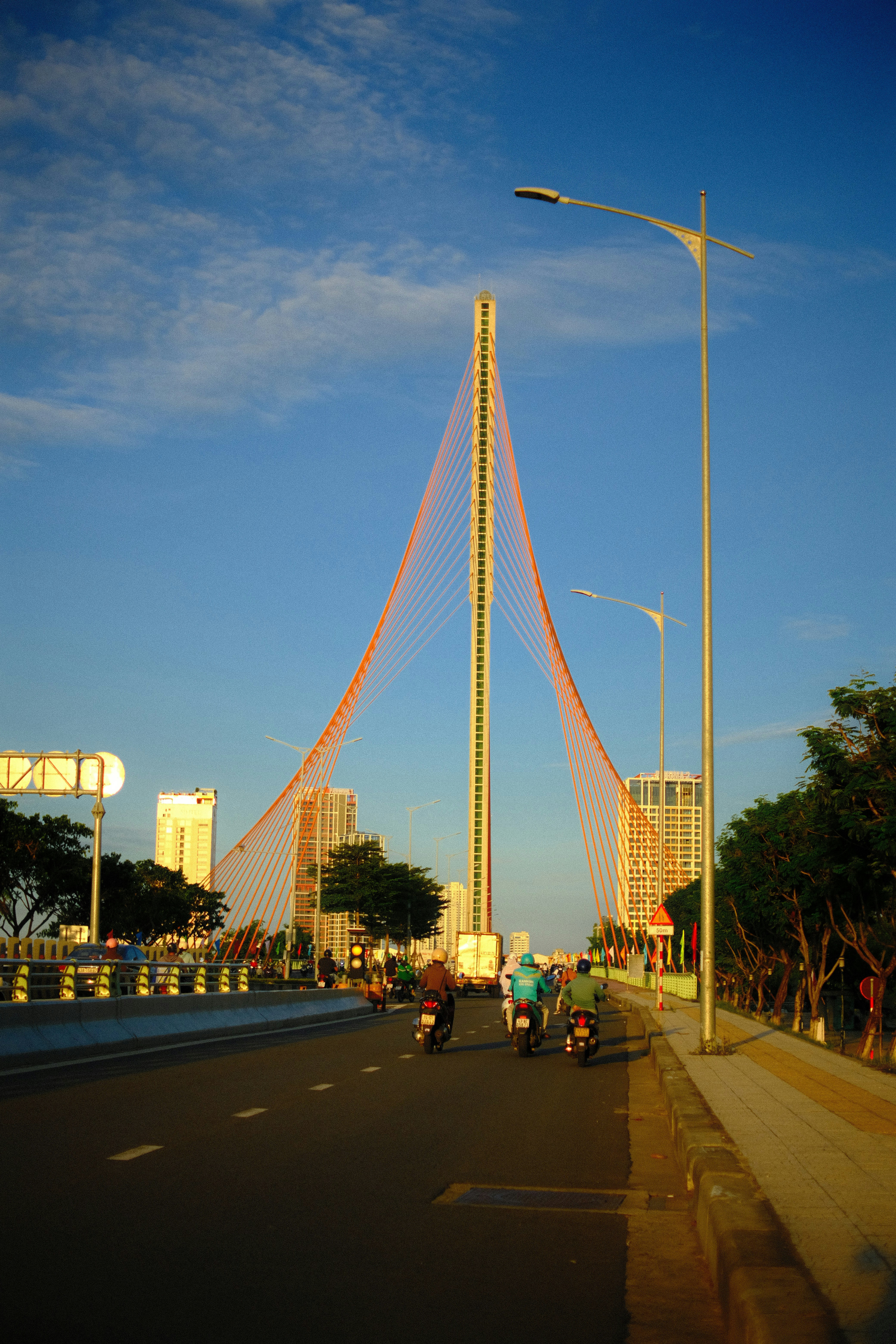 Modern cable-stayed bridge with traffic on road