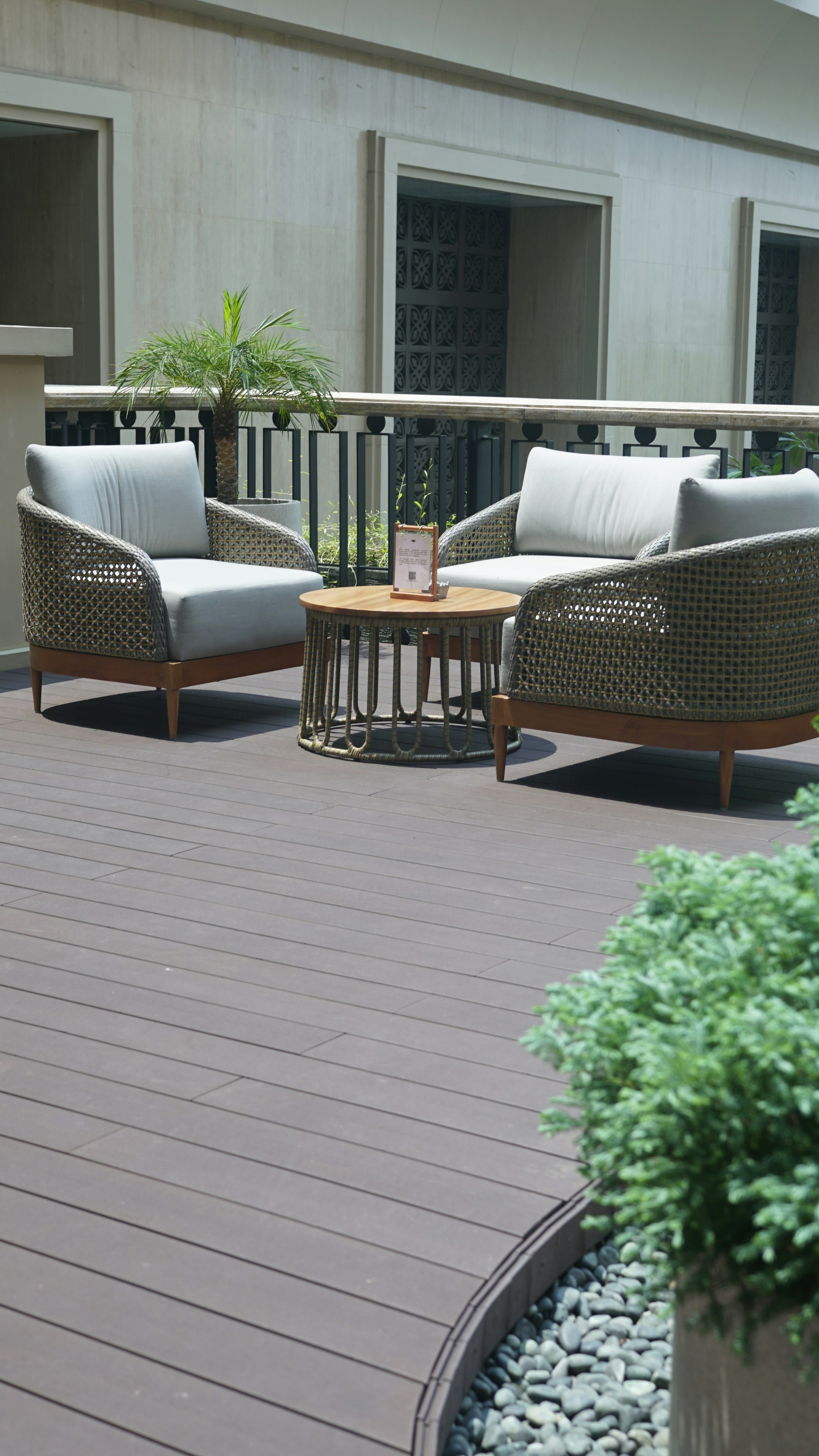 Luxury design | Outdoor patio furniture with chairs and a coffee table.