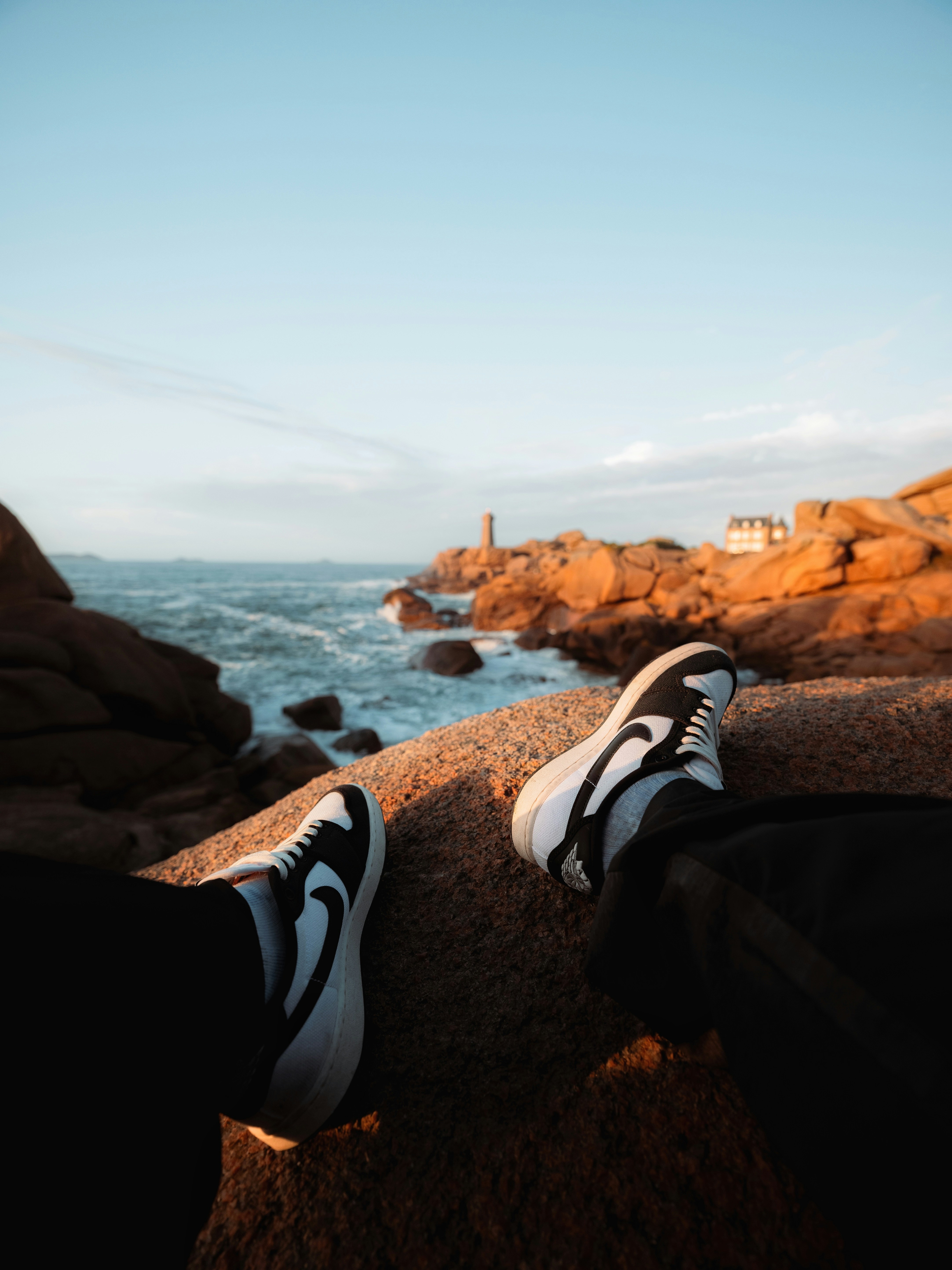 Seaside Solitude: A Moment on the Rocks