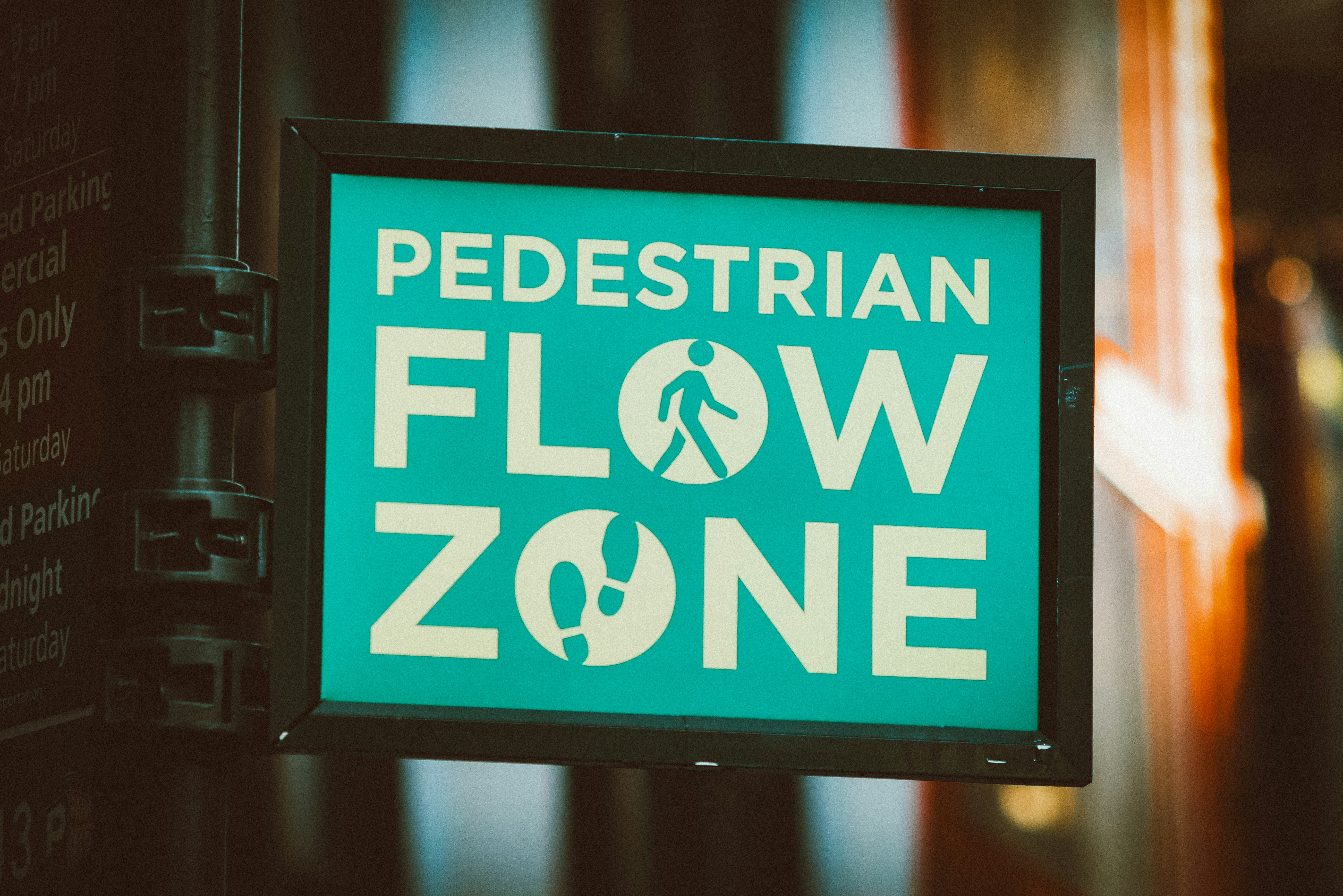 Pedestrian flow zone sign with icons