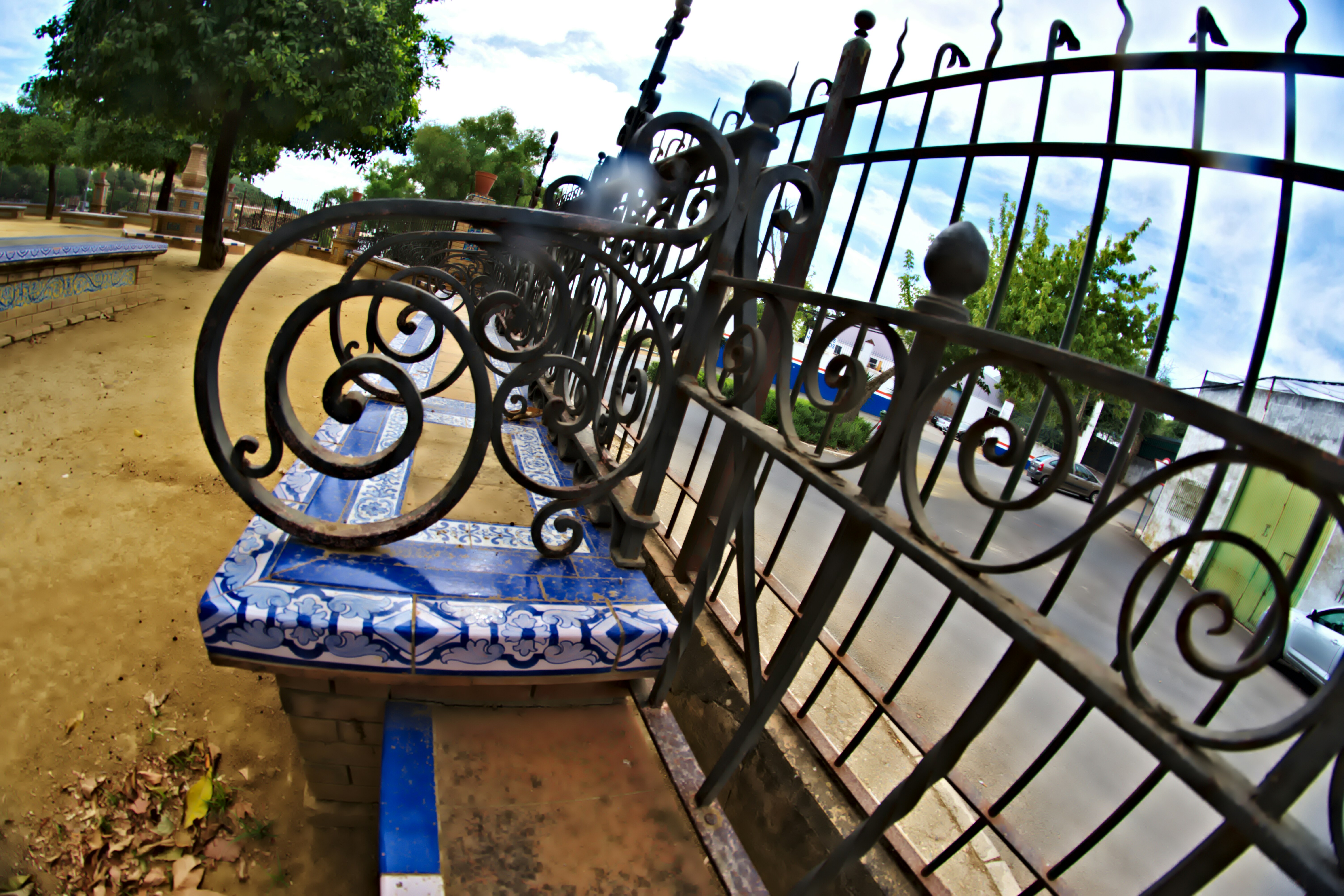 Ornate Serenity: A Bench of Blue and Iron