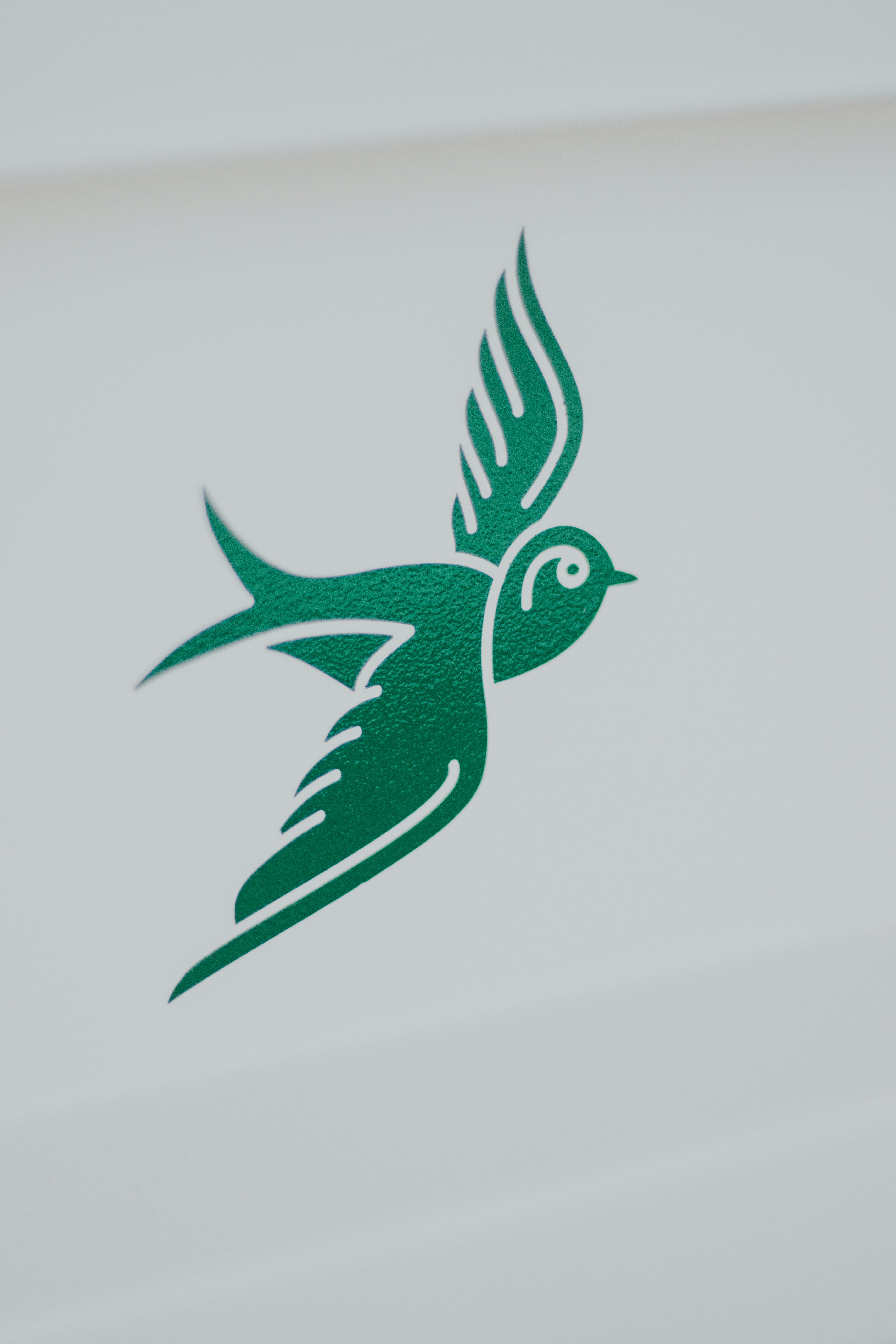 Soaring Elegance: The Green Avian Emblem
