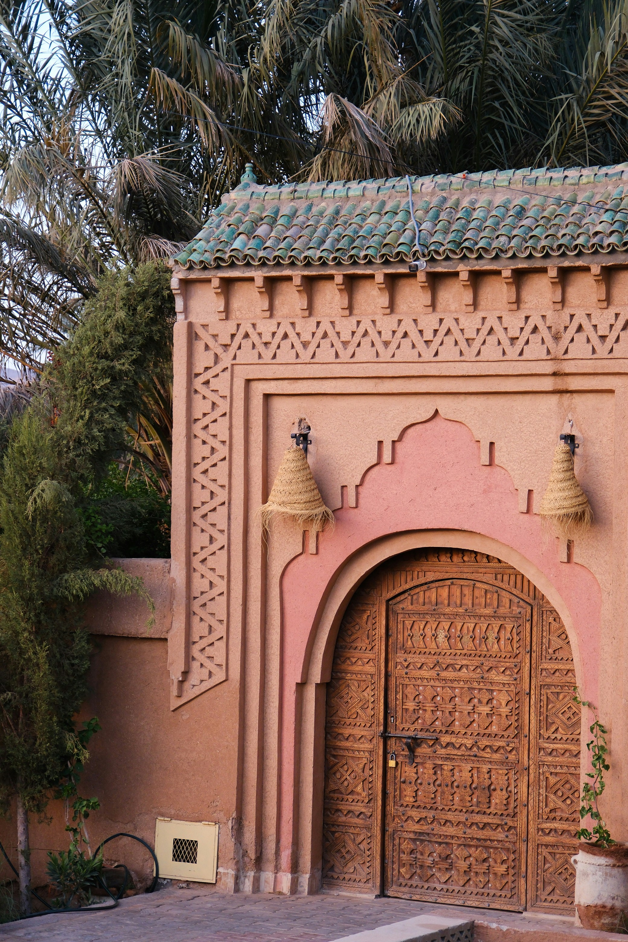 Ornate wooden door with moroccan architectural details