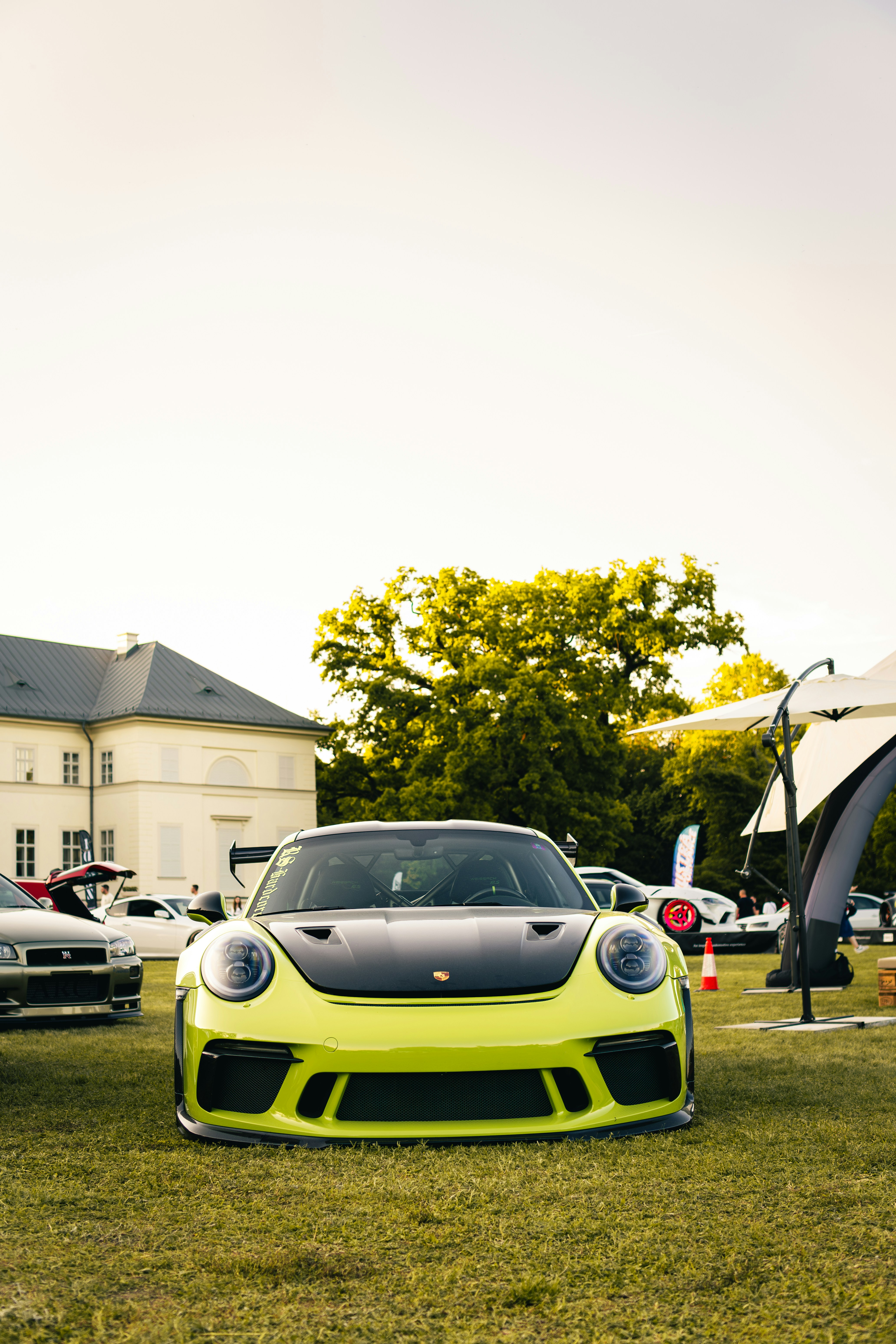 Porsche 911 GT3 RS Hardcore | Lime green sports car parked on grass
