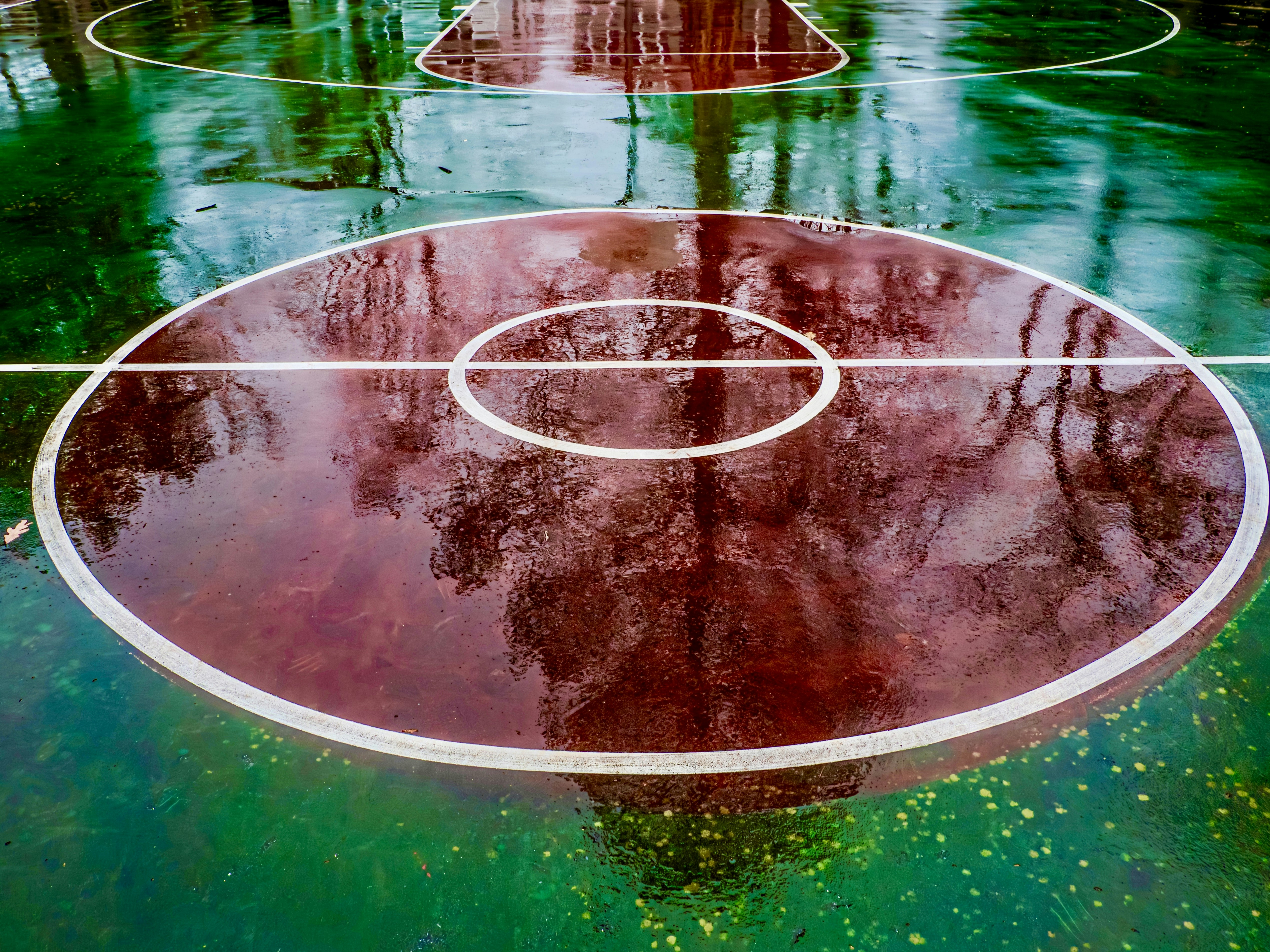 Reflections of Play: A Rainy Day on the Court