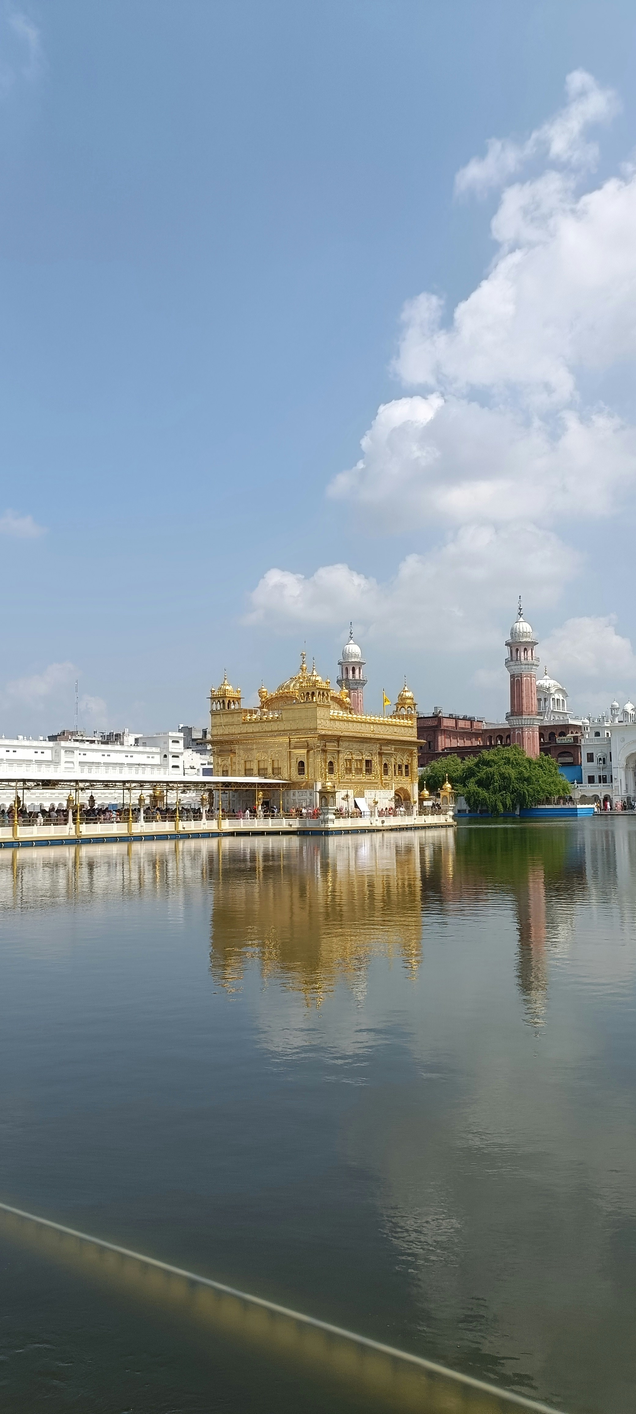 You can help the creator for more creativity. saabart7@gmail.com | Golden temple reflected in the water under a cloudy sky