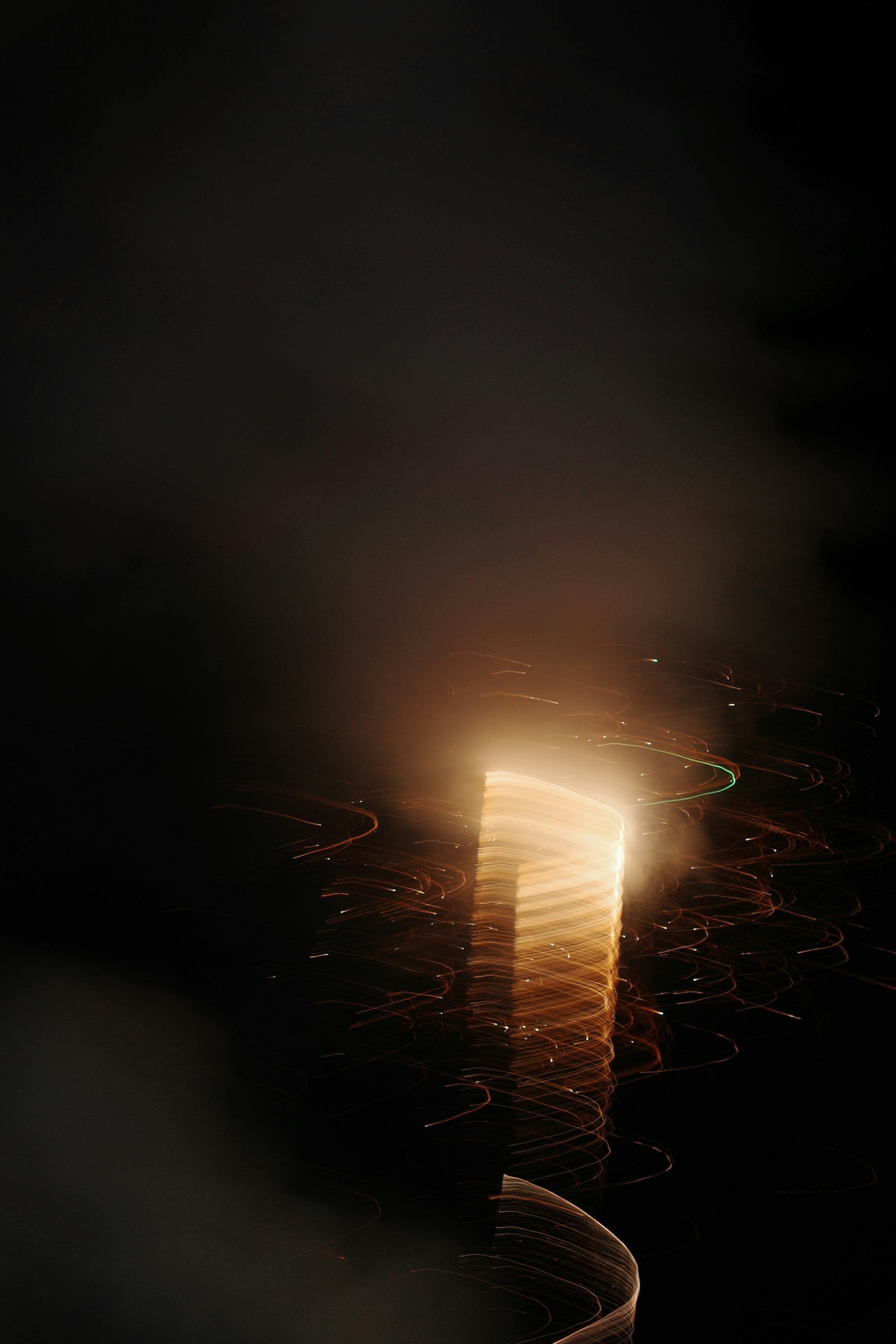 Abstract light streaks around a glowing rectangular shape