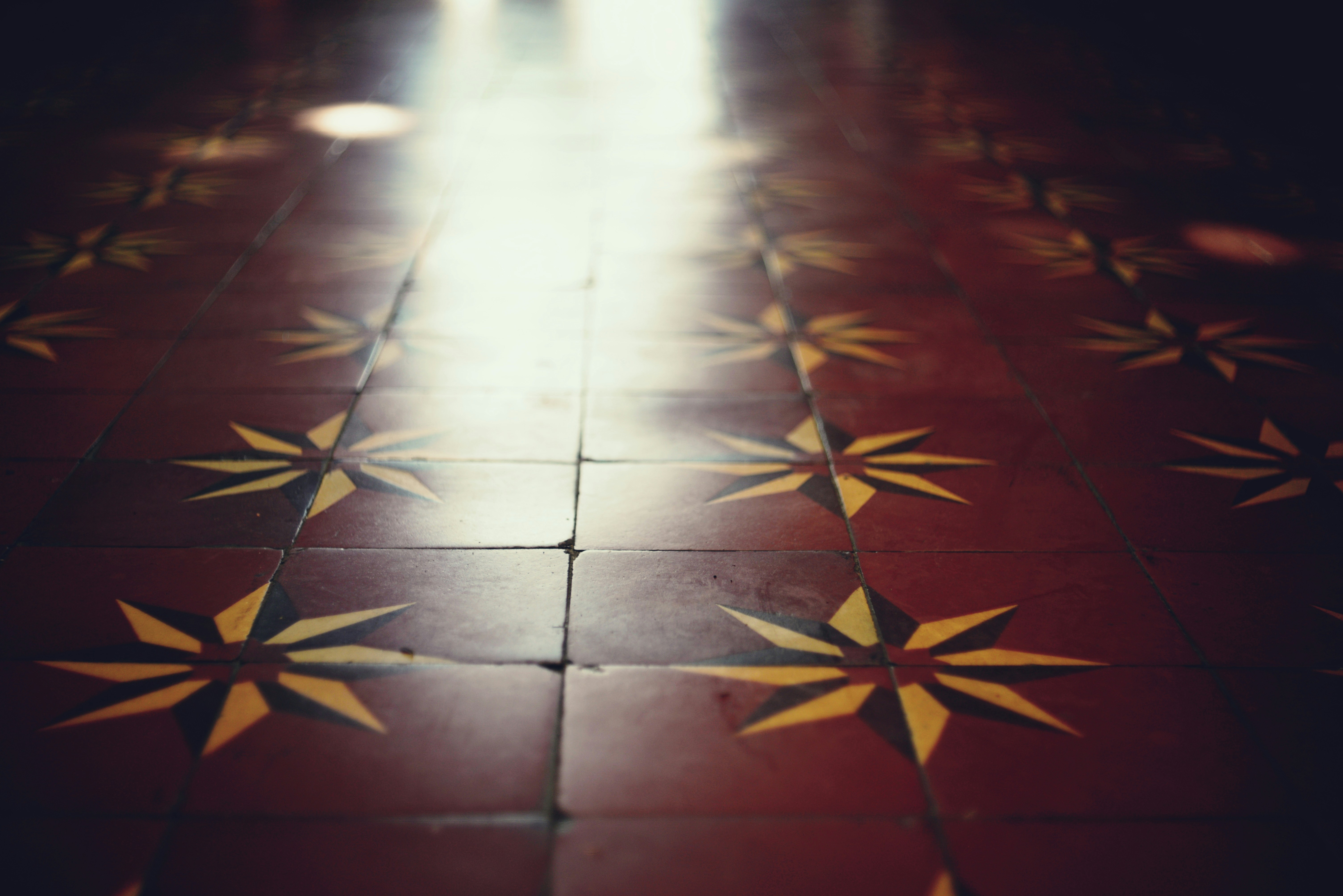 Sunlit Star Tiles: Quiet Geometry in a Dim Corridor