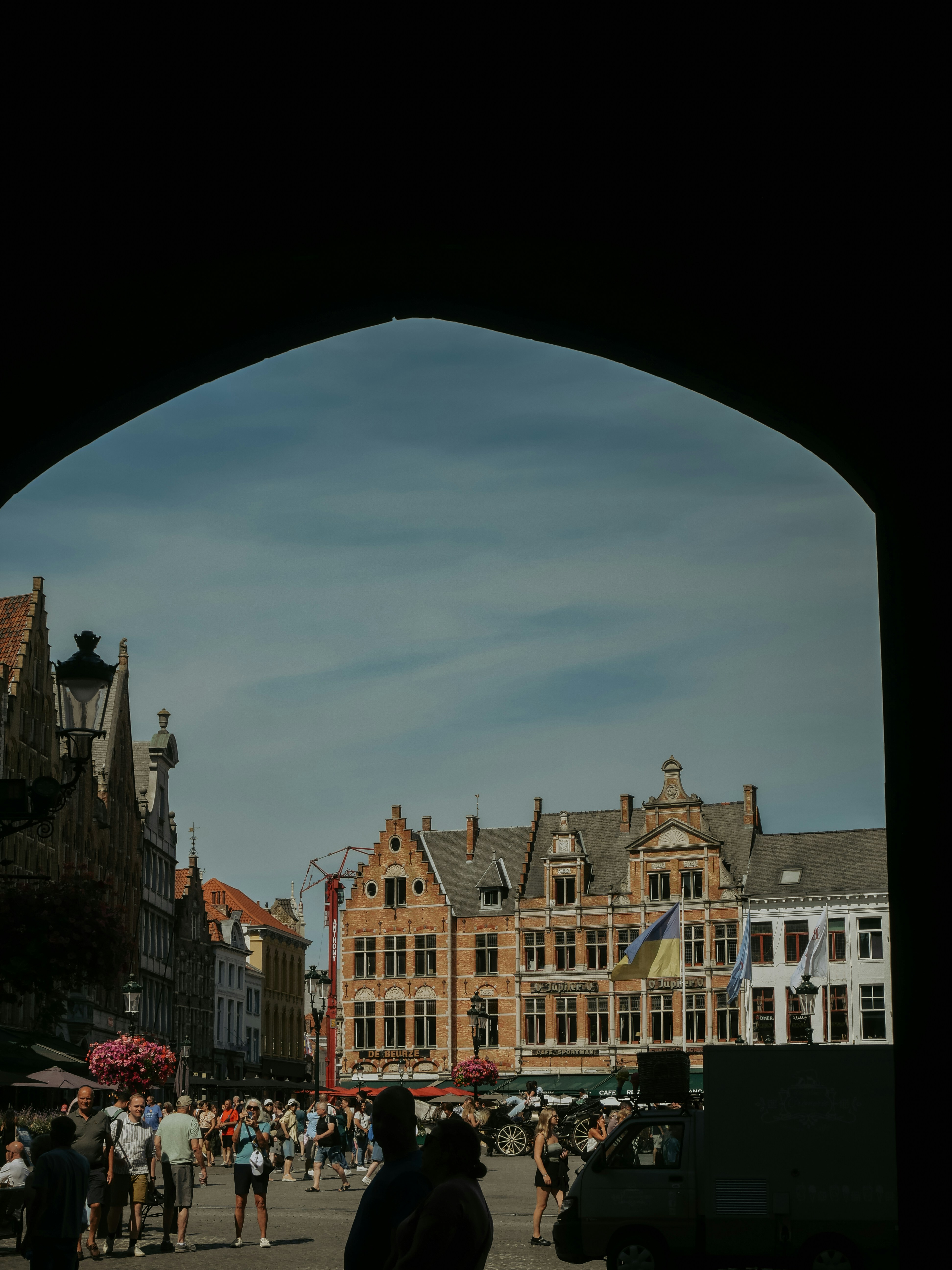 Brugge | People walking in a european town square