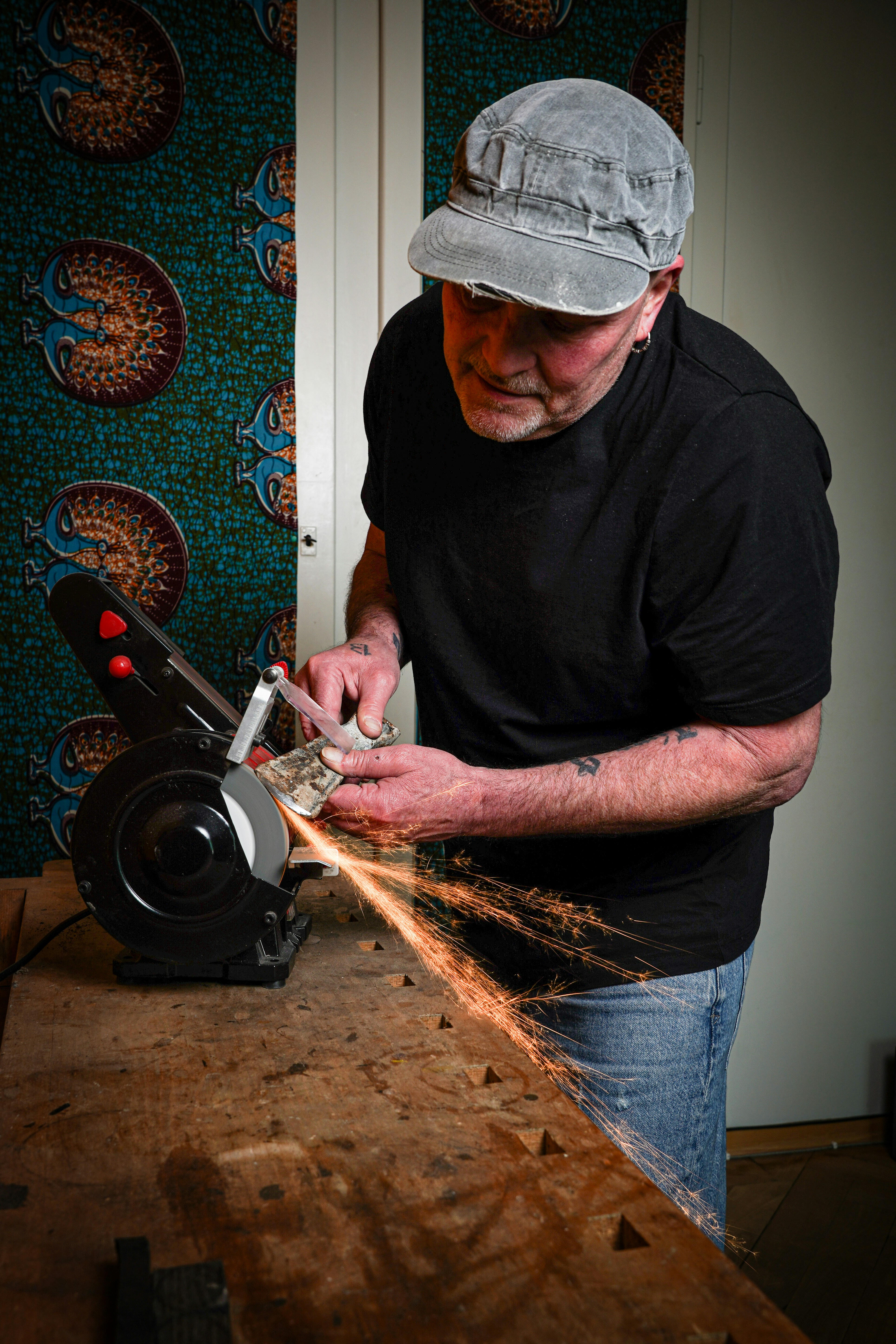 The Grinder's Rhythm: Sparks Fly as a Craftsman Shapes Steel