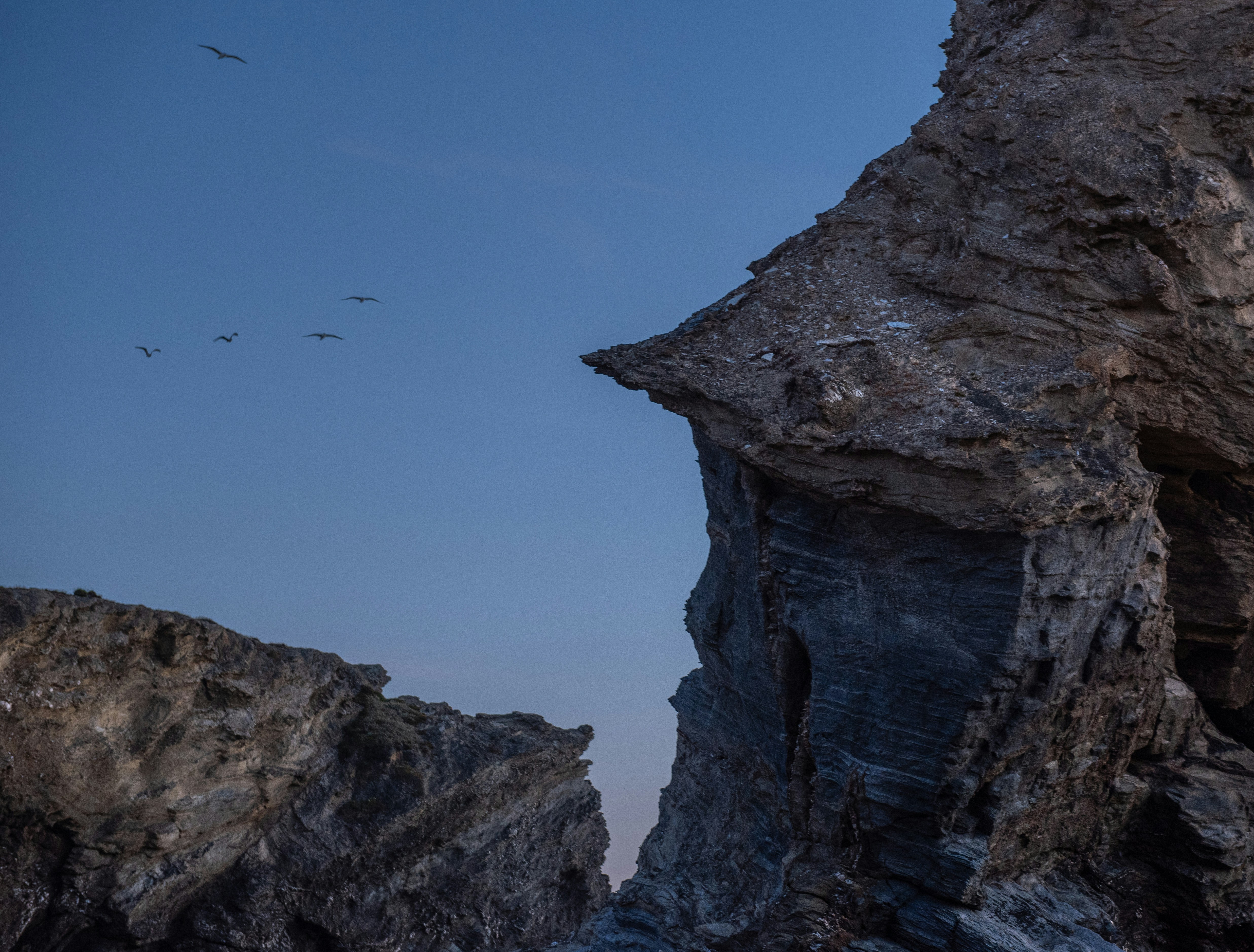 Gap Between Giants: A Narrow Sky Through Weathered Cliffs