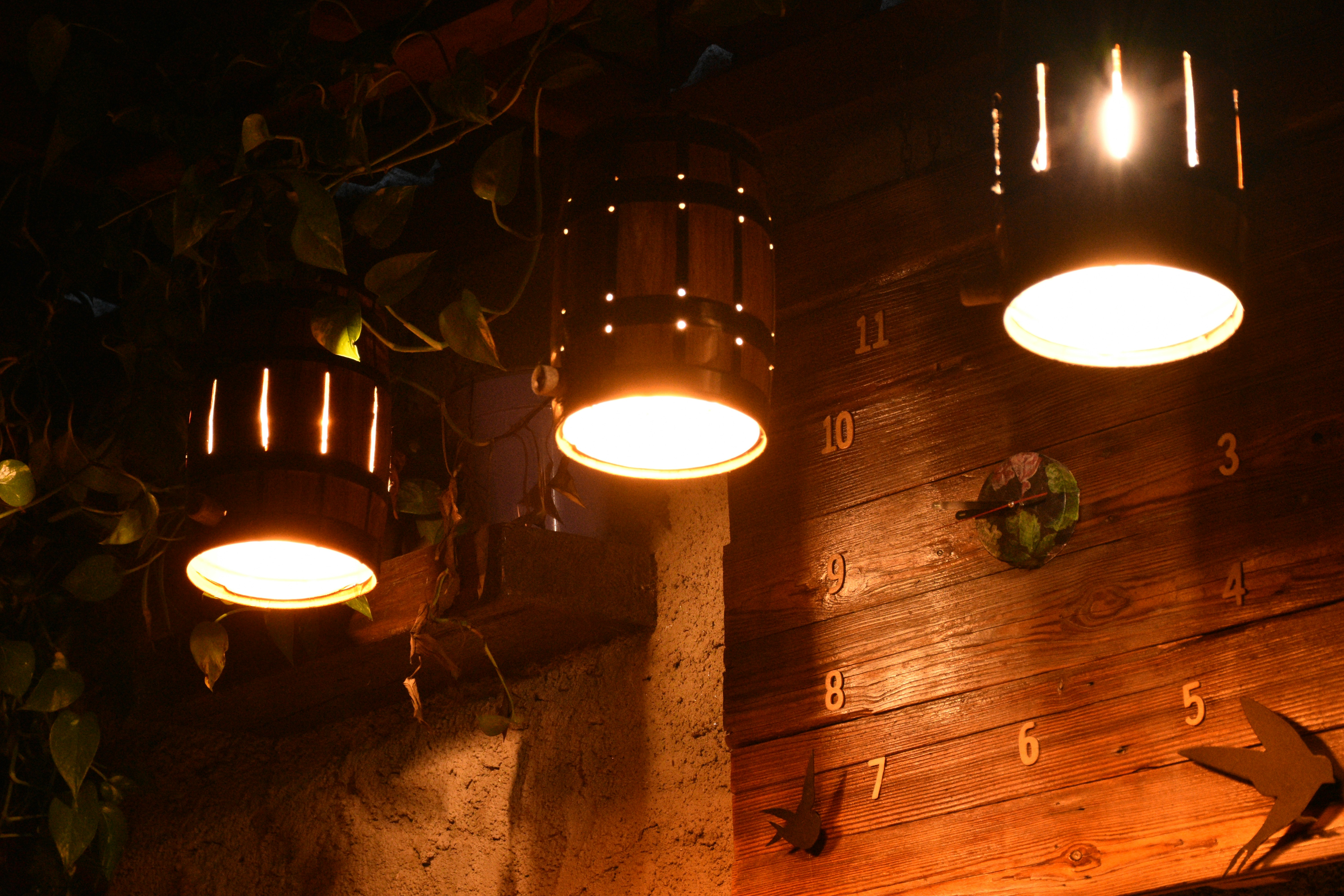 Warm Lanterns on a Rustic Wall