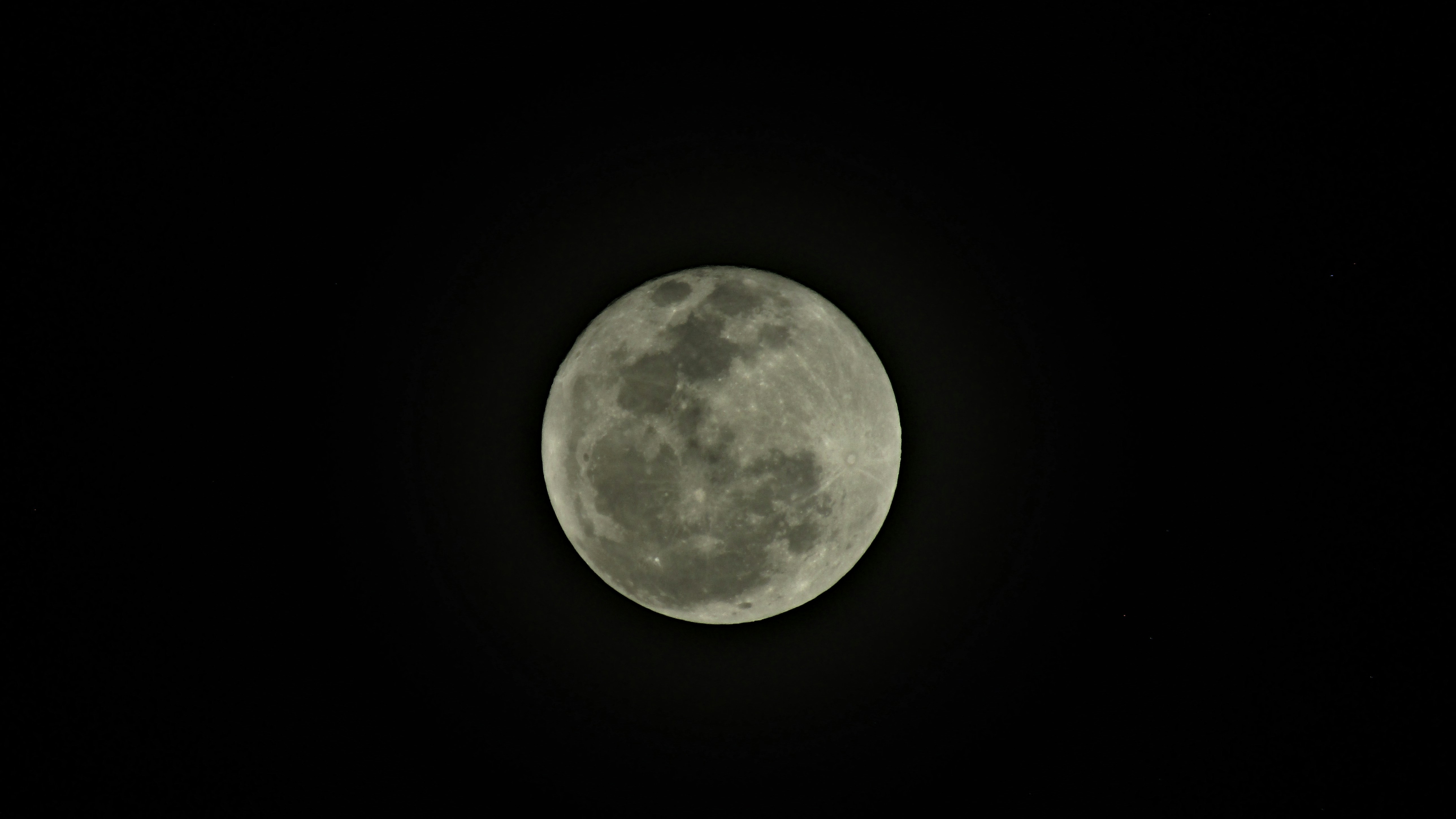 The Virgo New Moon was on the 23rd of August, this photo was taken a day later. It was one of the first photos I managed to completely edit with RawTherapee. Taken on the 24th of August 2025. | Full moon glowing in the dark night sky