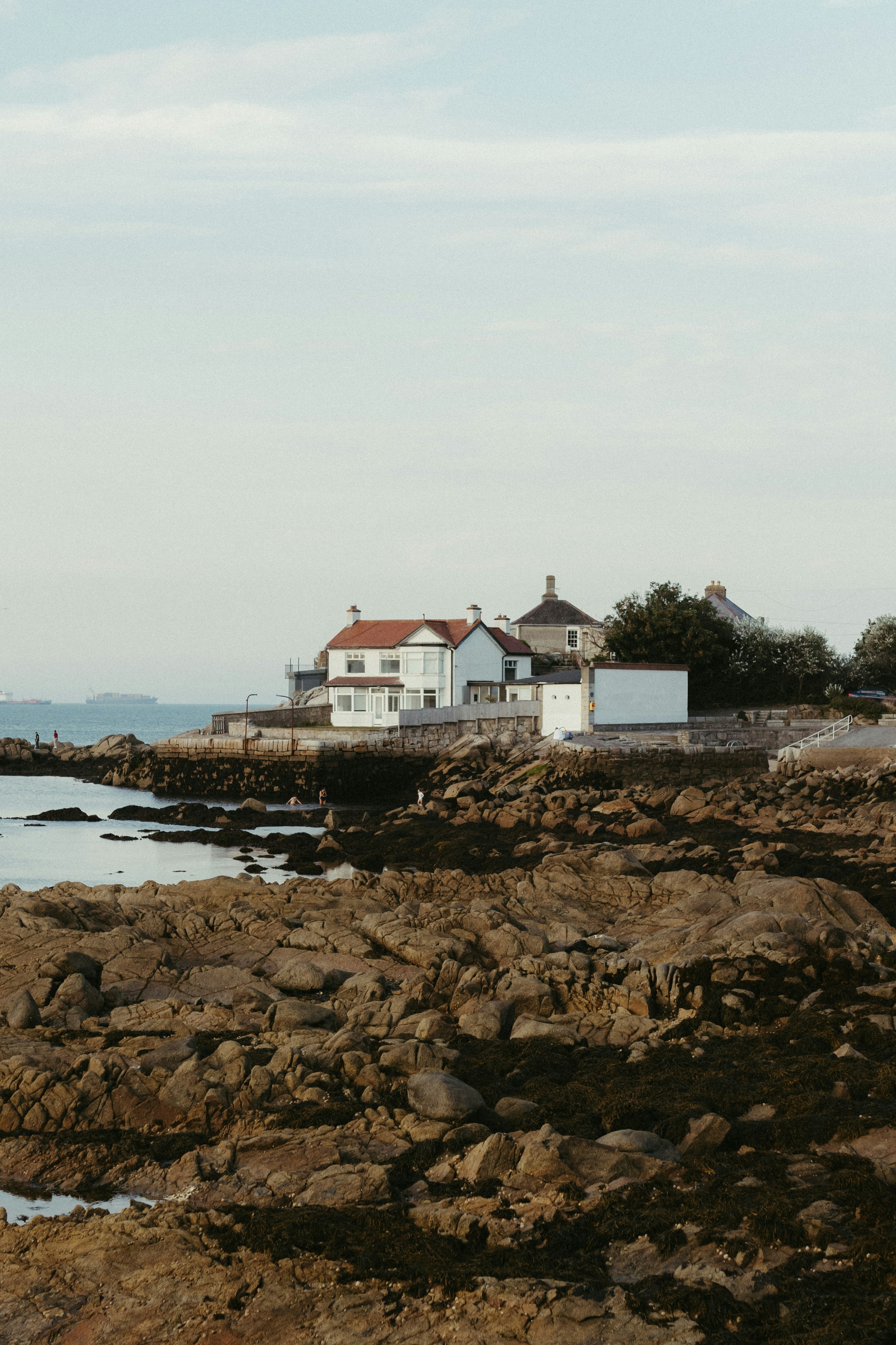 Rocky coastline with houses overlooking the sea