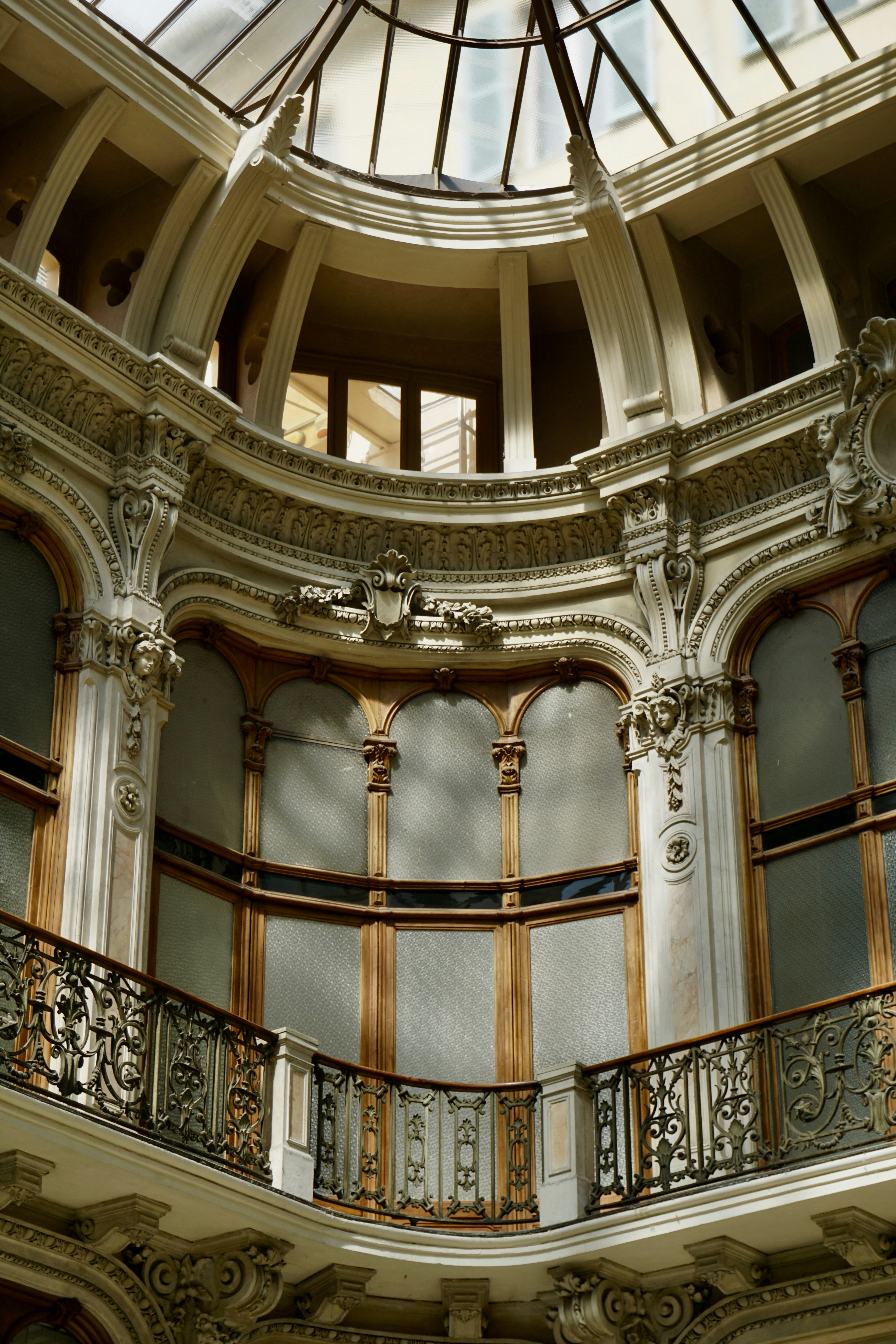 Ornate interior of a historic building with a domed ceiling.