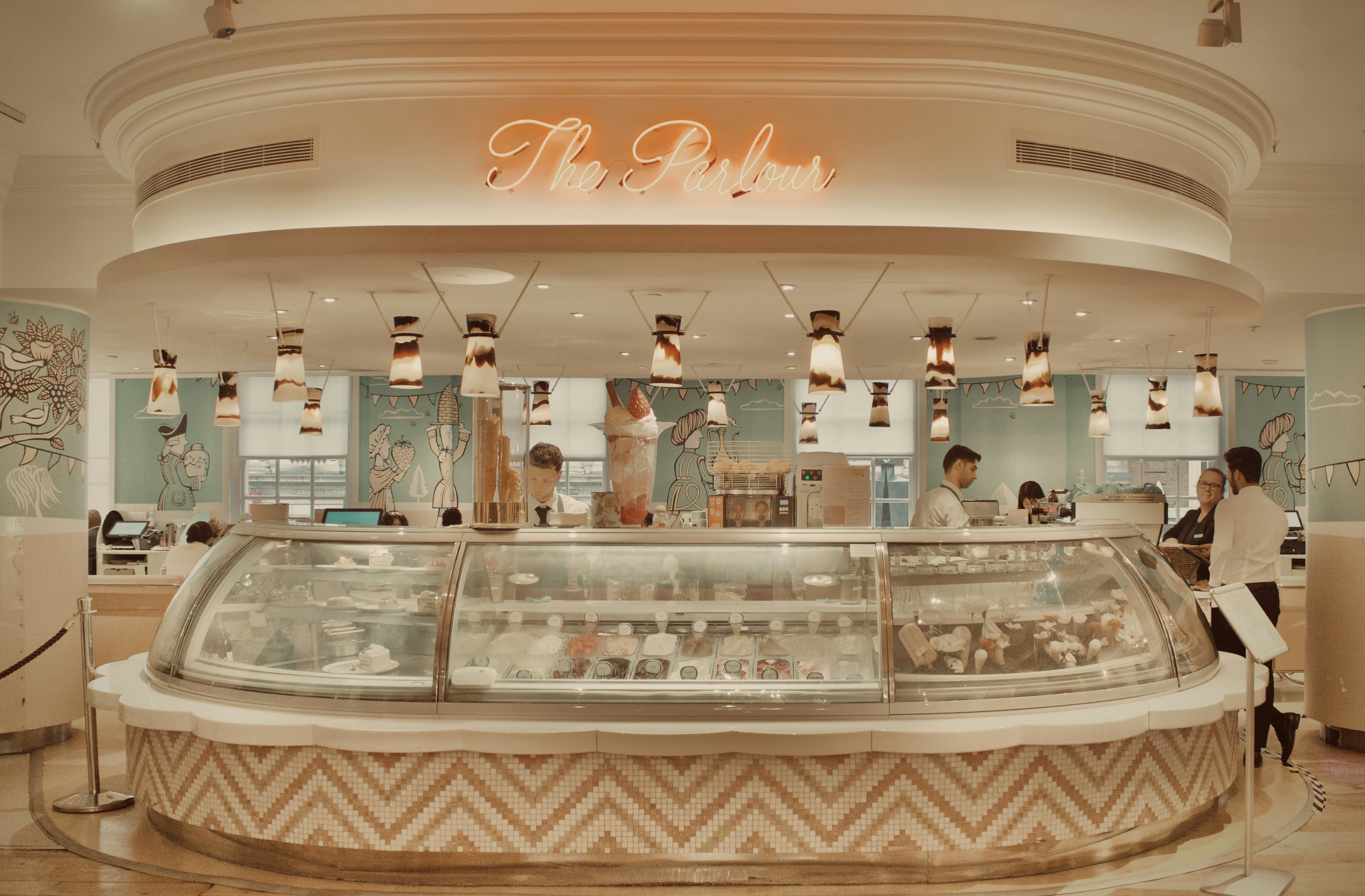 Interior of a dessert shop with display cases.
