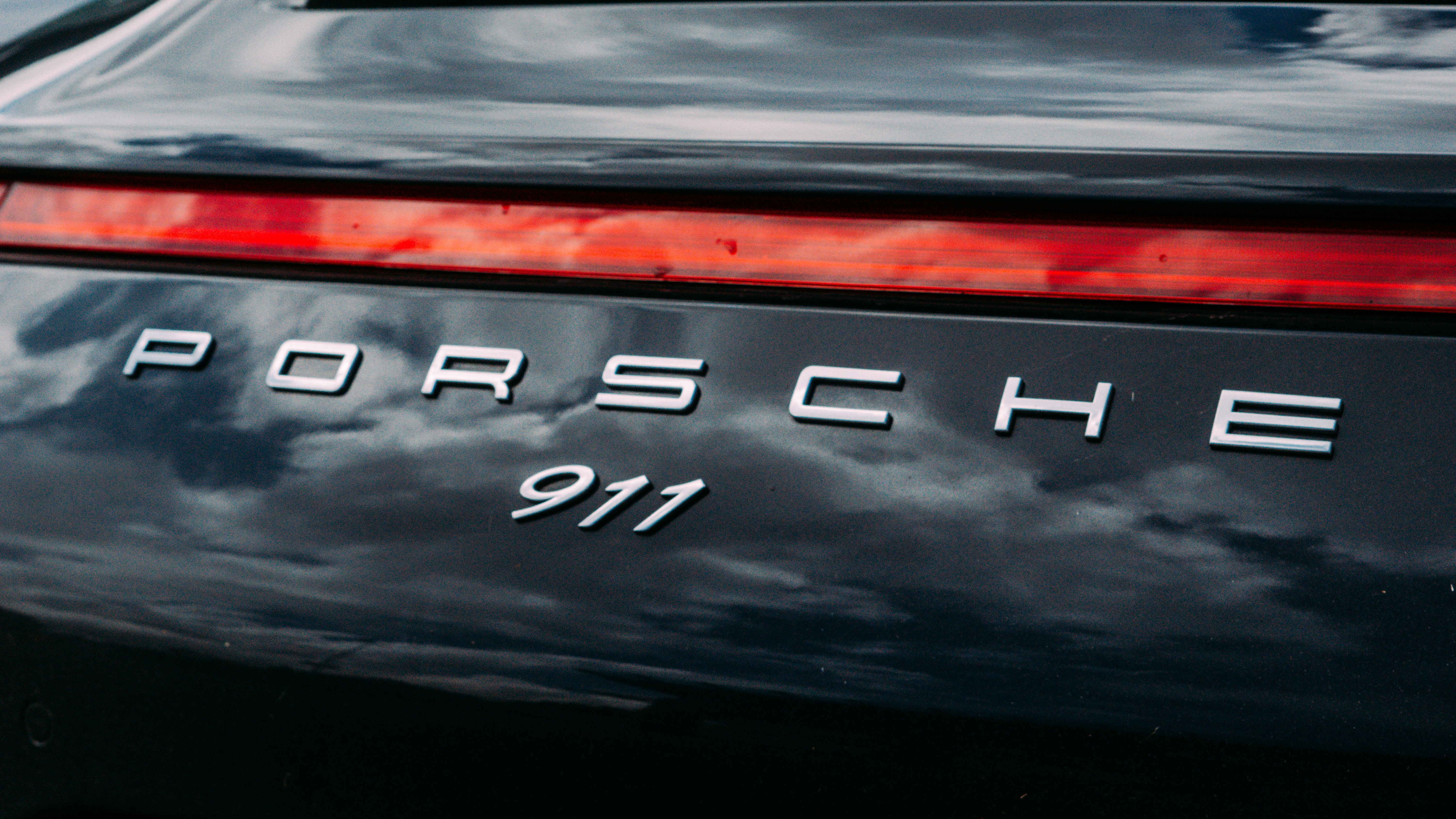 Elegance in Motion: The Porsche 911 Emblem