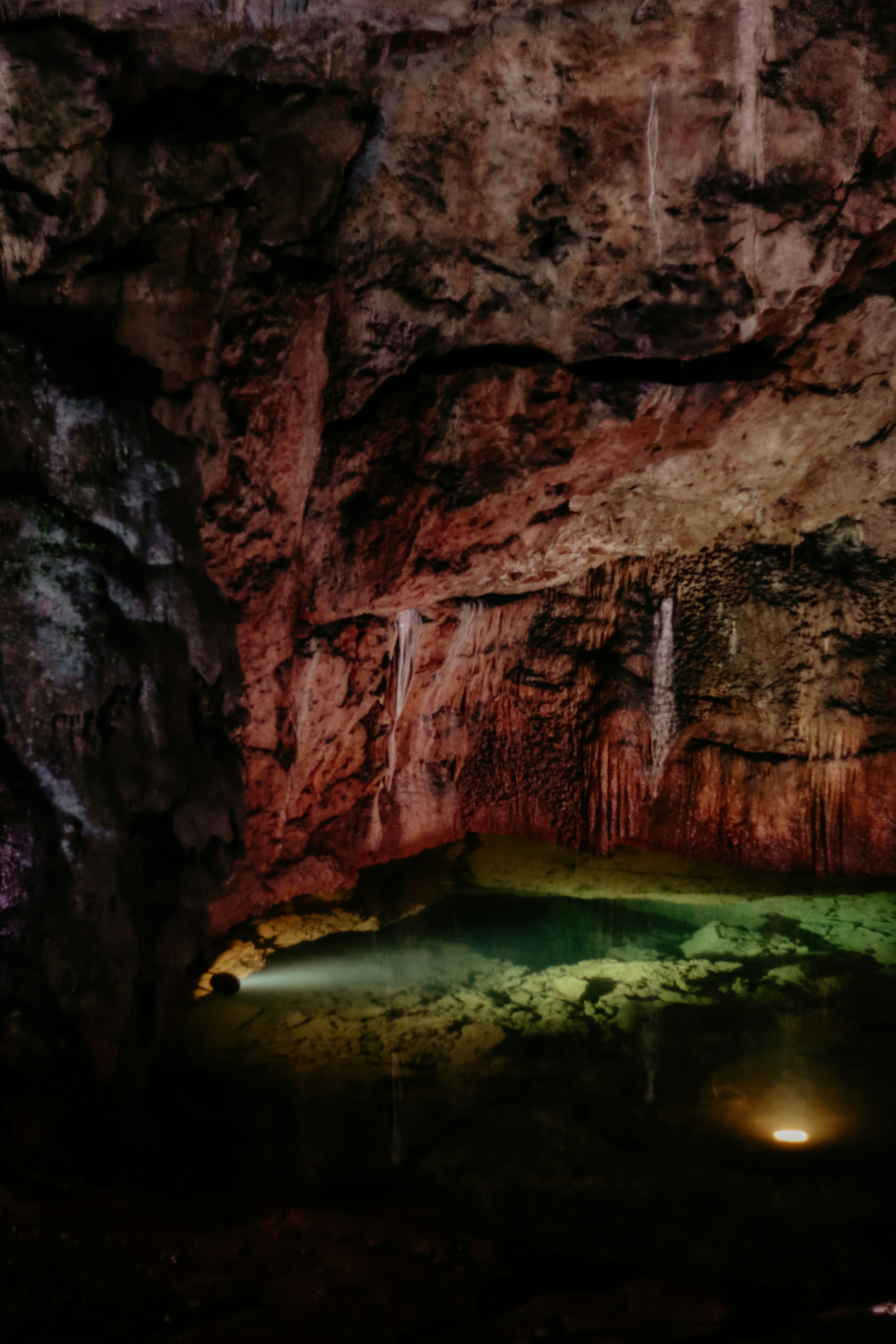 Cave with glowing green water and stalactites photo – Free Dark Image ...