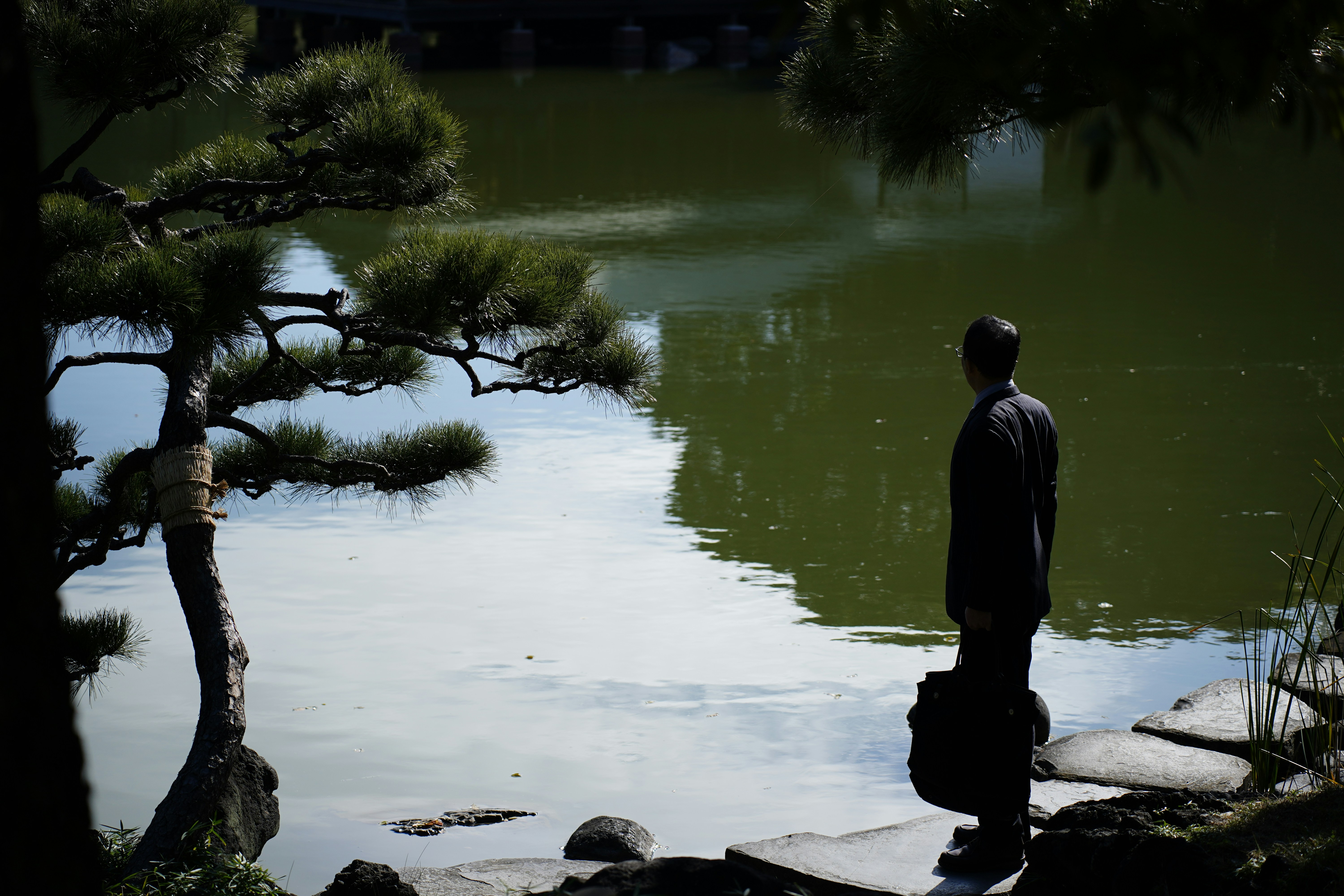 Reflections of Solitude: A Moment by the Water