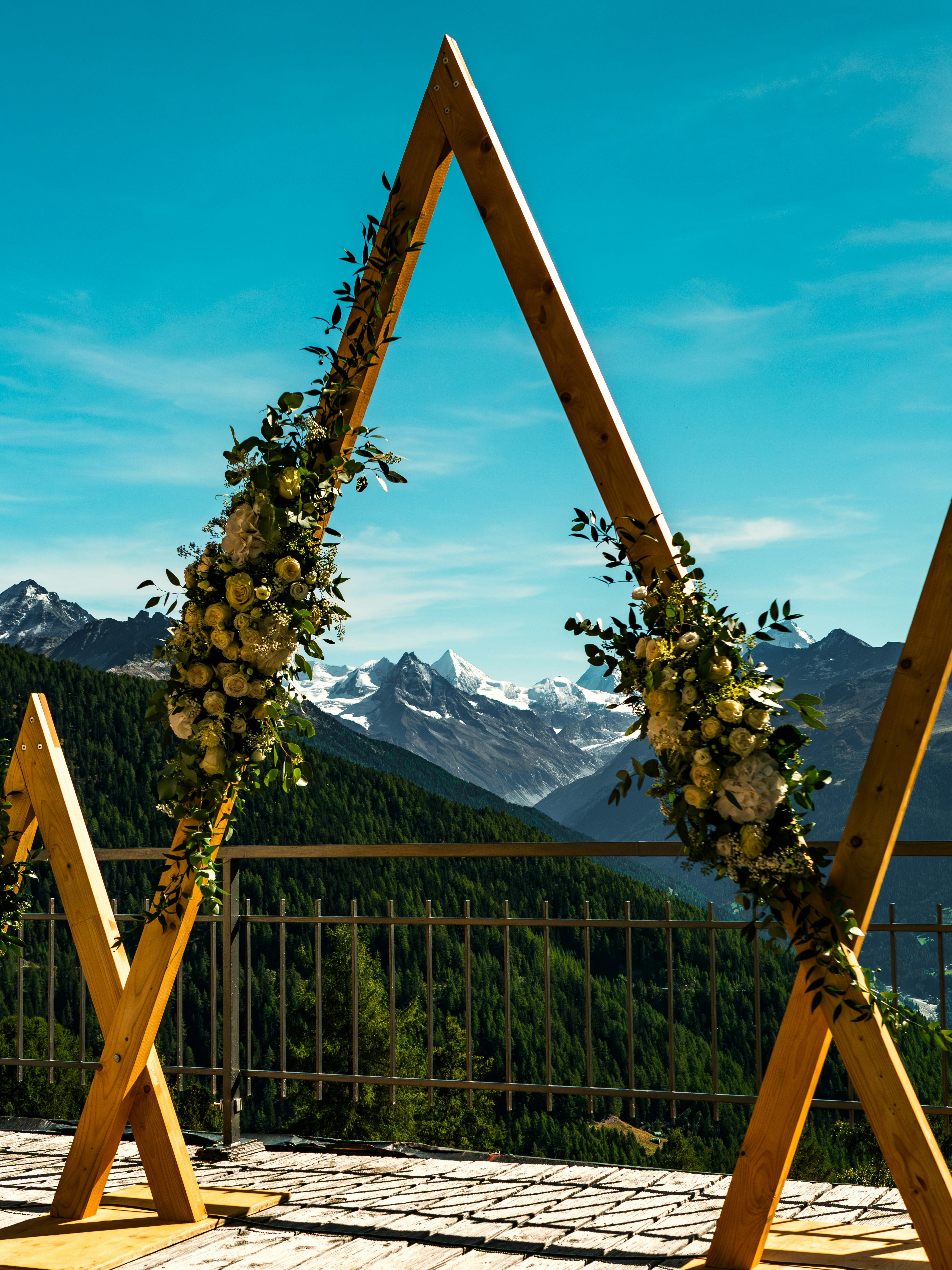 Floral Archway Framing the Alpine Ridge