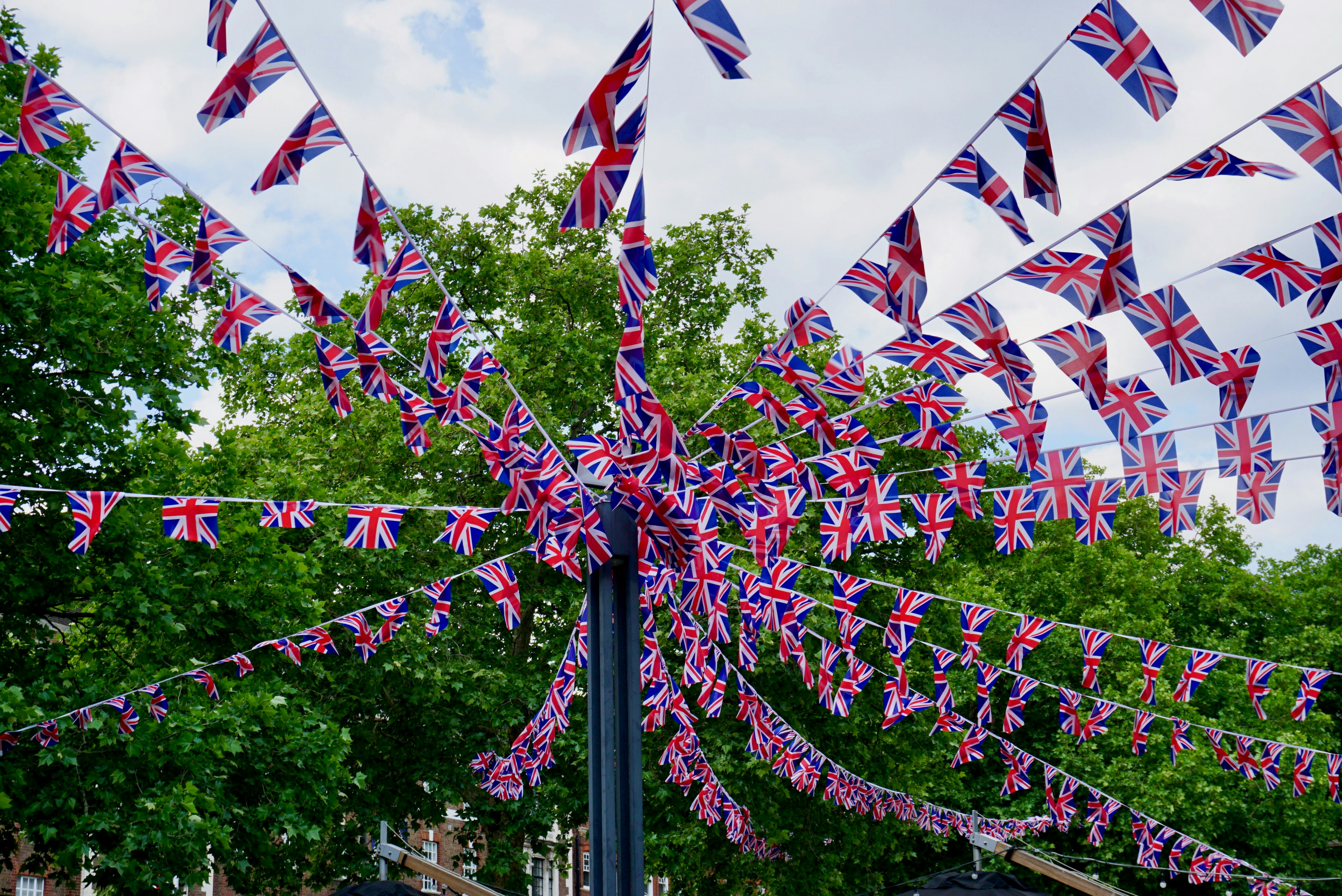 Union jack flags strung across a street.