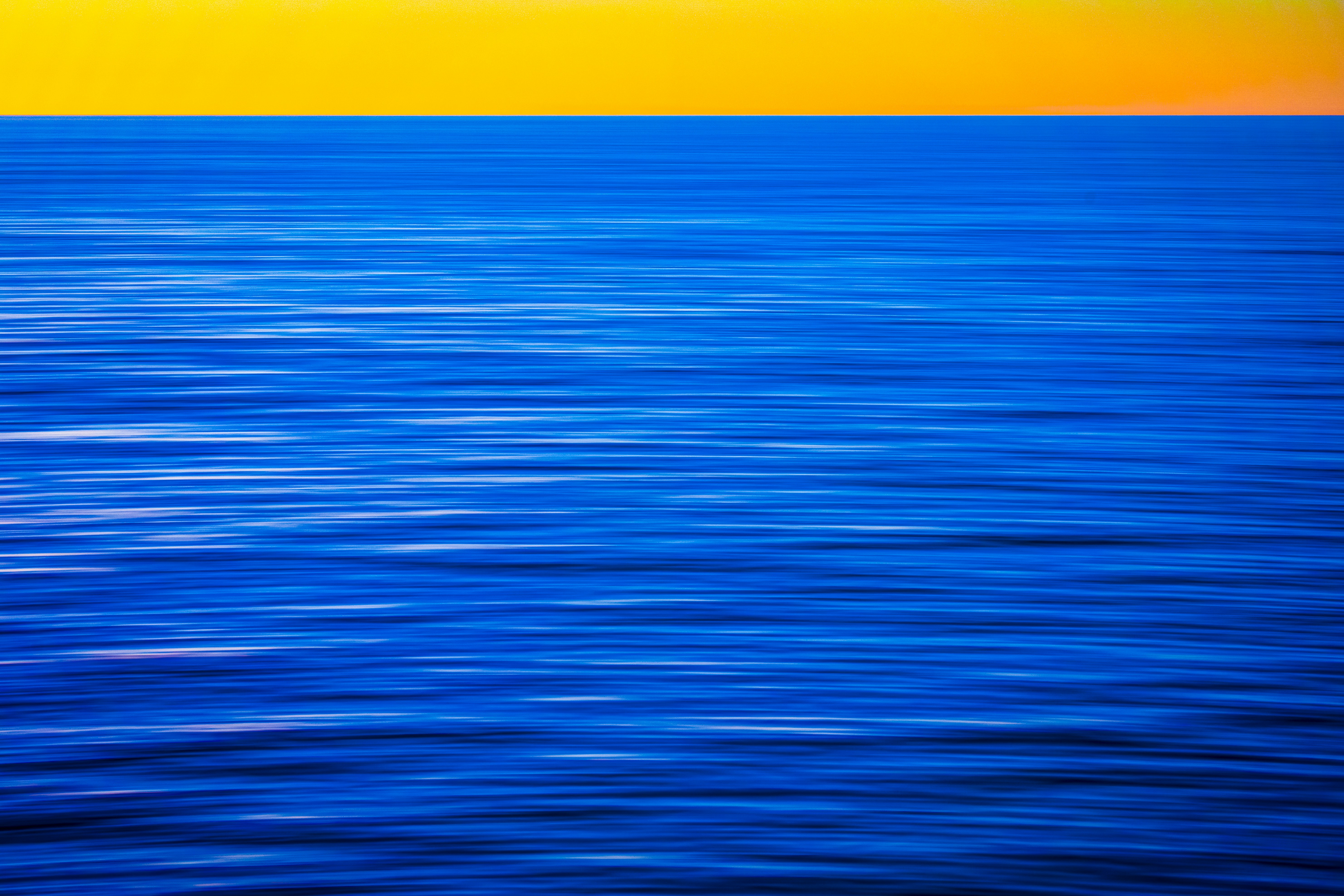 Serene Horizon: A Dance of Blue and Gold