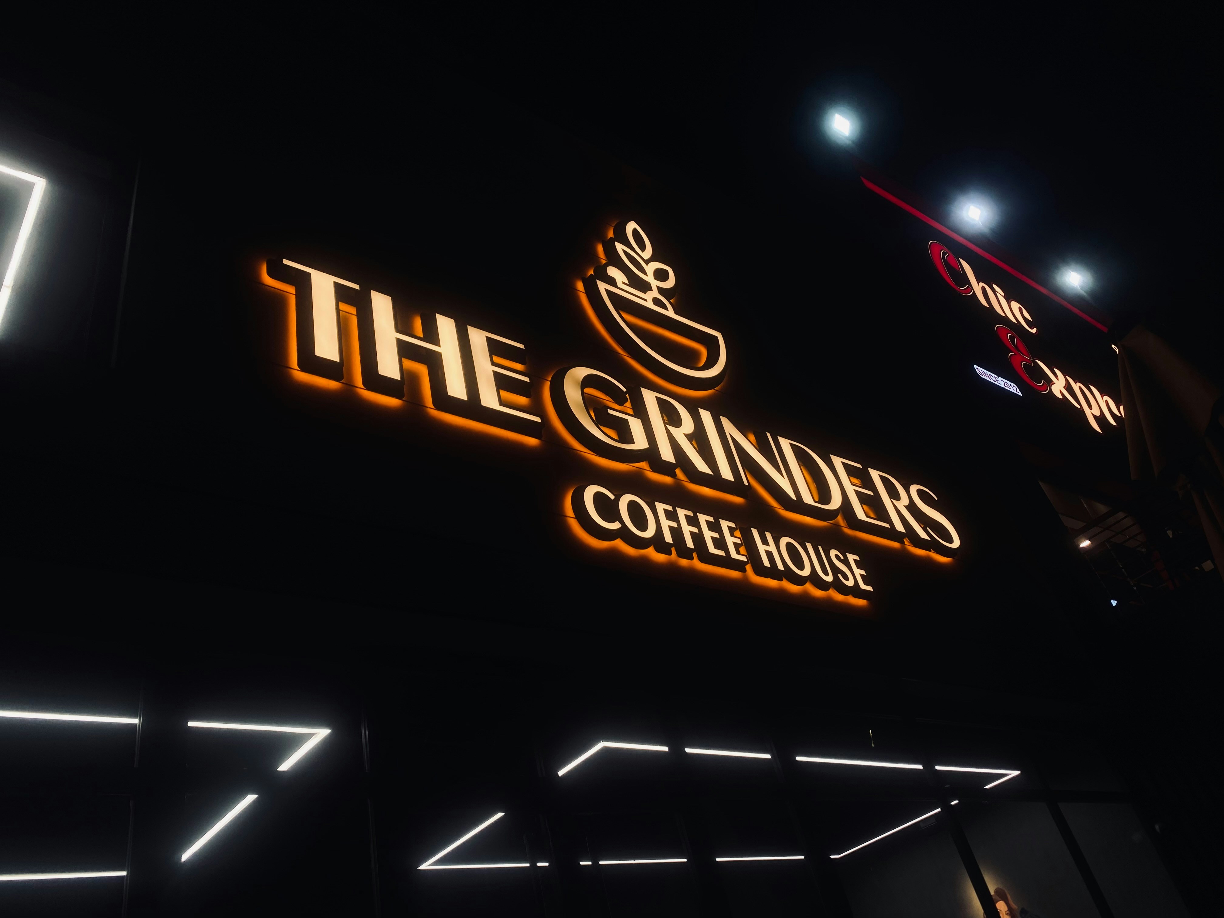 Illuminated Haven: The Grinders Coffee House at Night