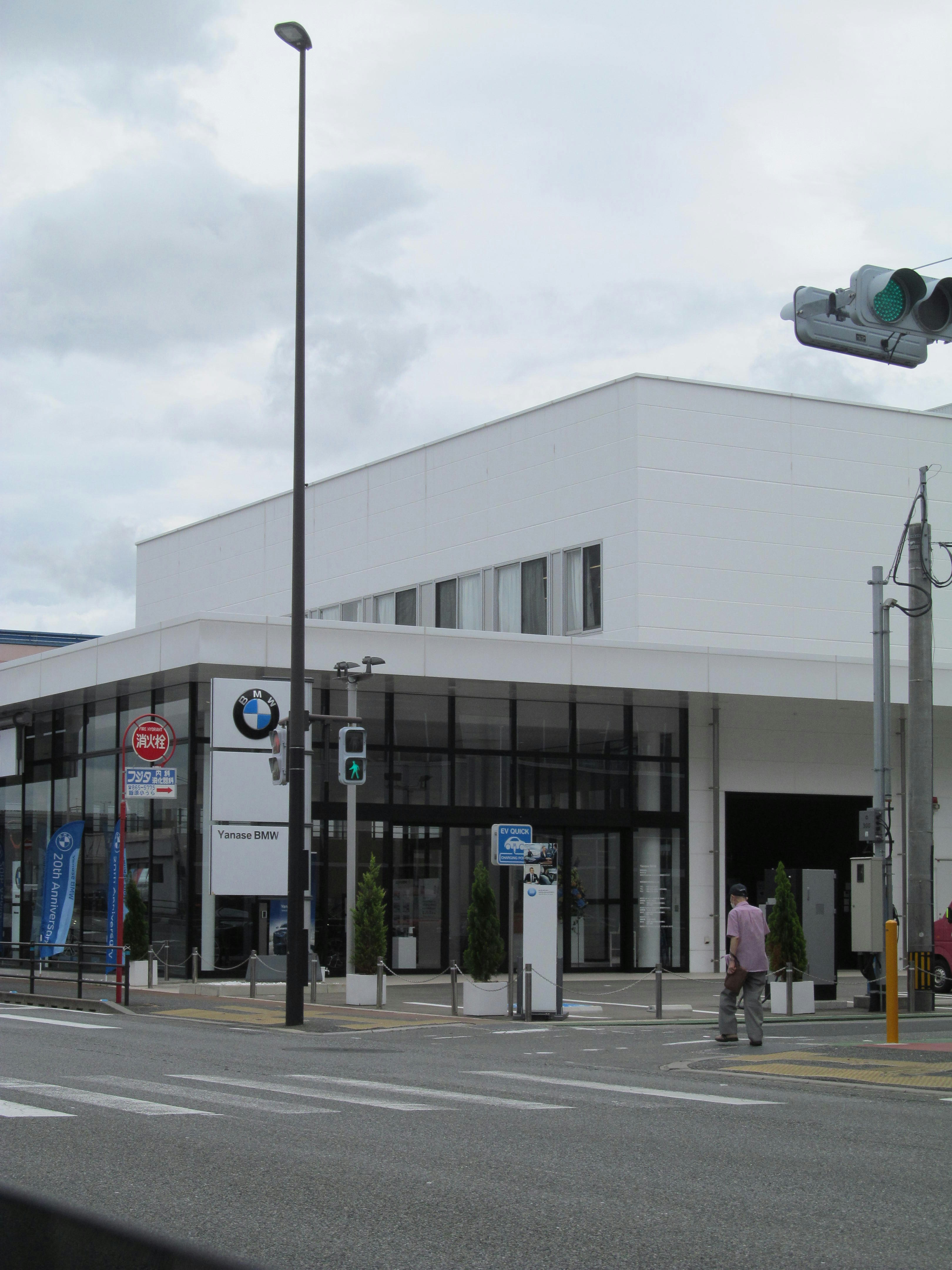 Modern white building with BMW dealership signage.