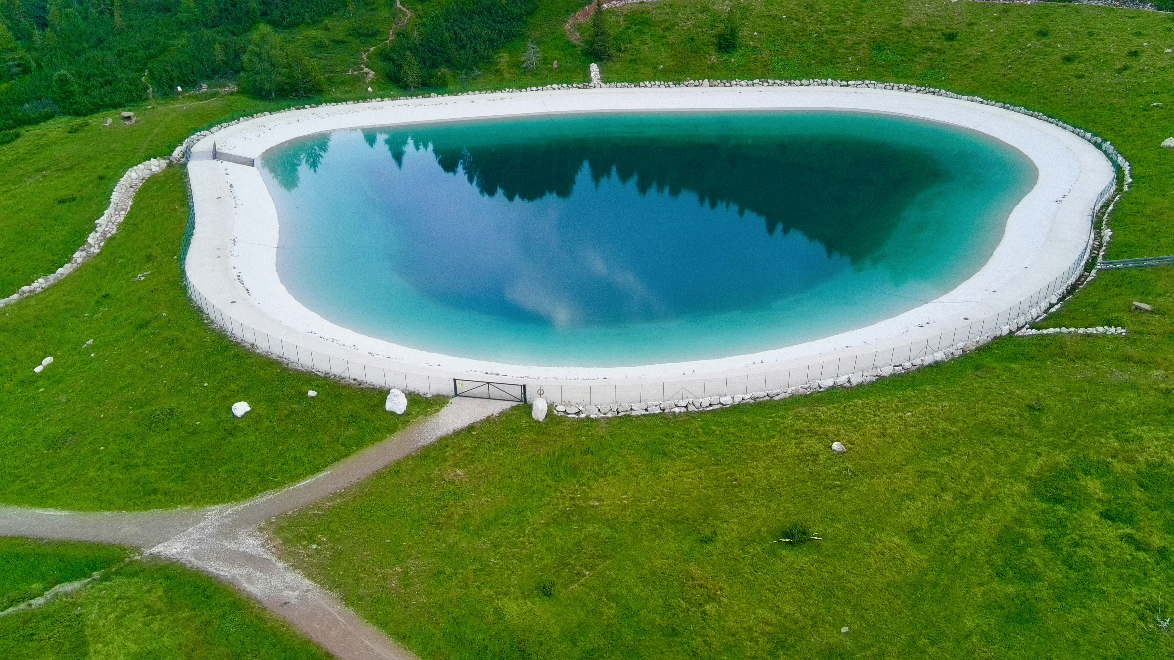 Artificial lake in a green mountain landscape